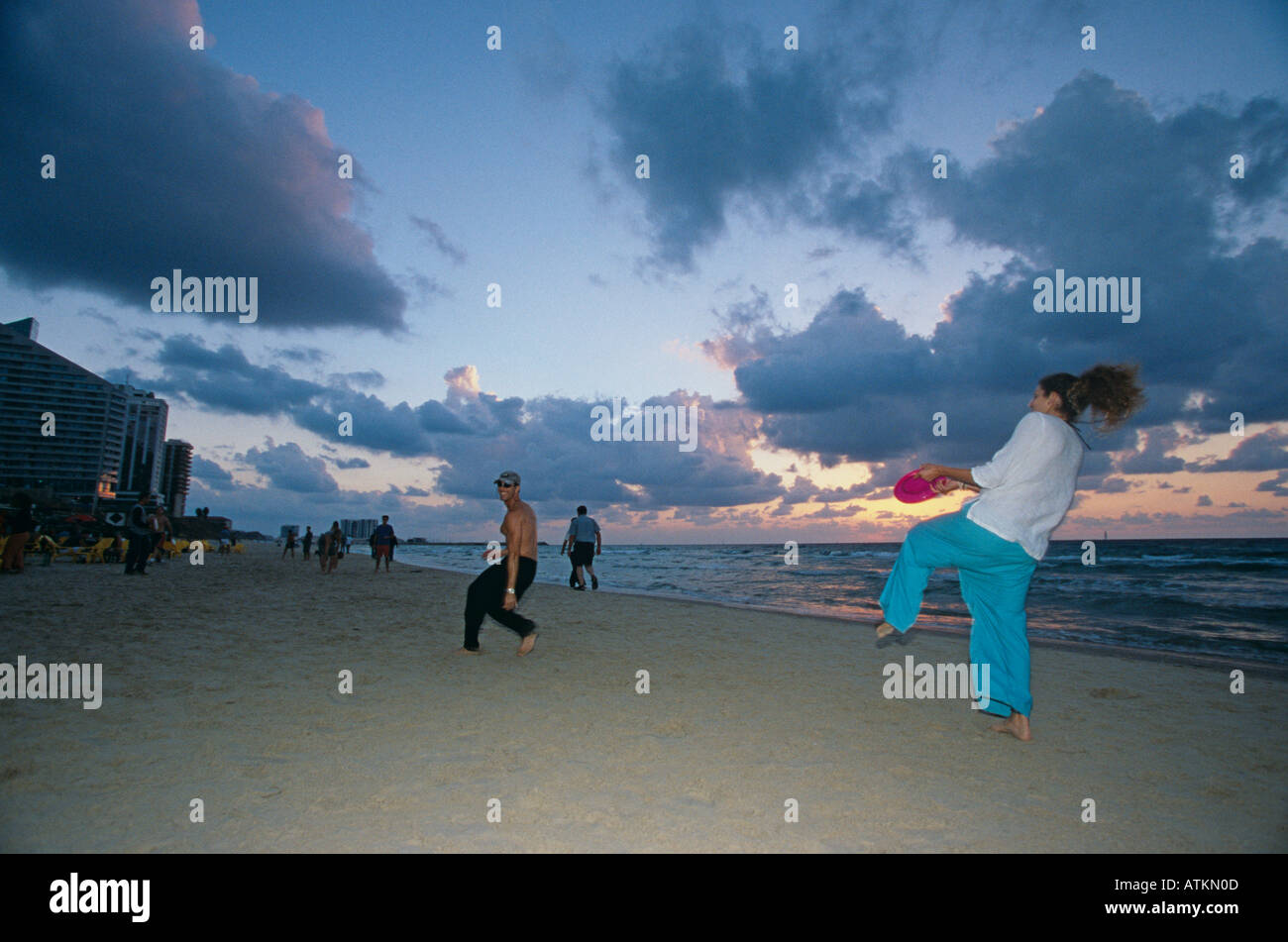 Man playing with frisbee on the beach hi-res stock photography and ...