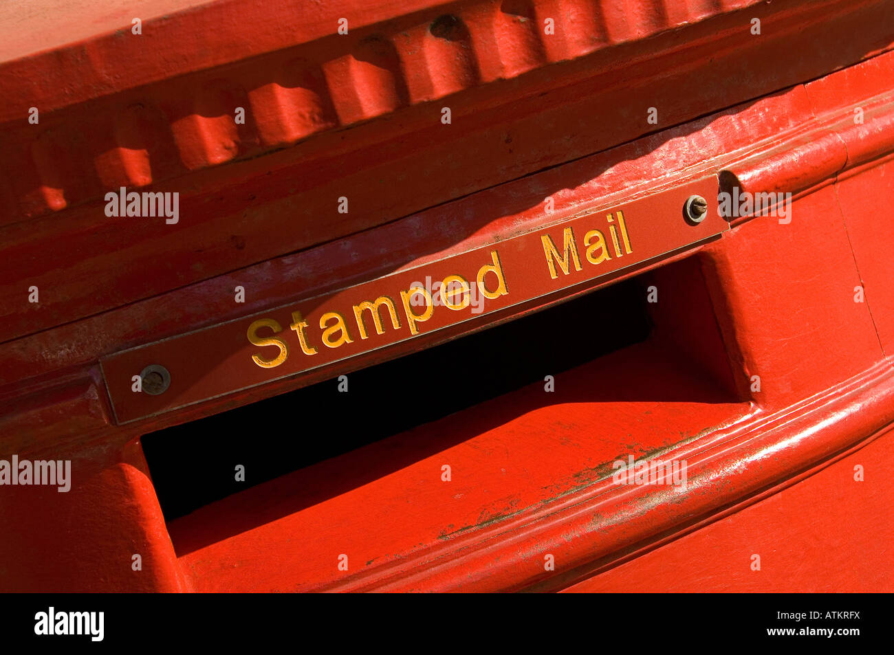 Red post box letterbox for stamped mail close up England UK United ...