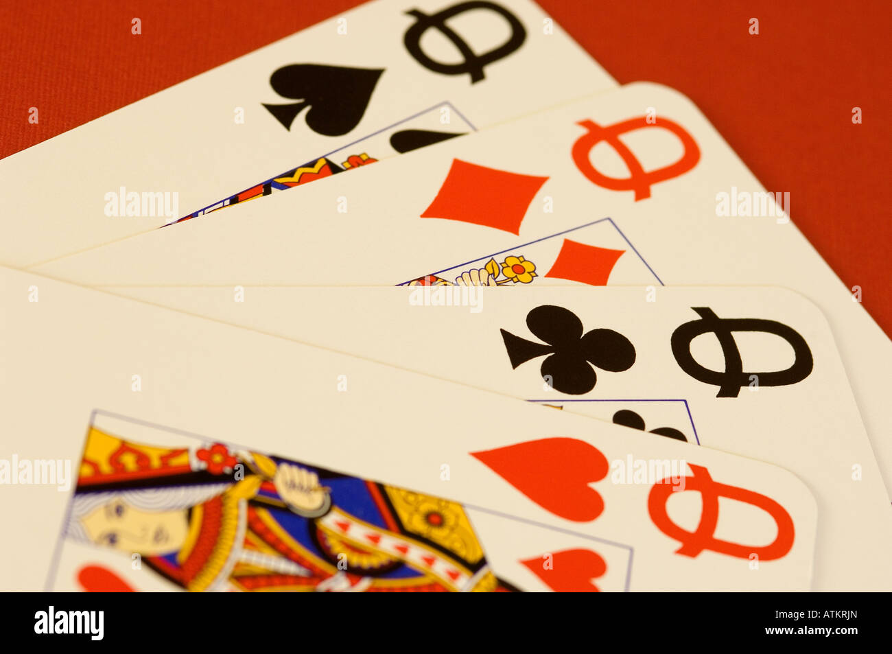 Playing cards 4 four queens close up Stock Photo - Alamy