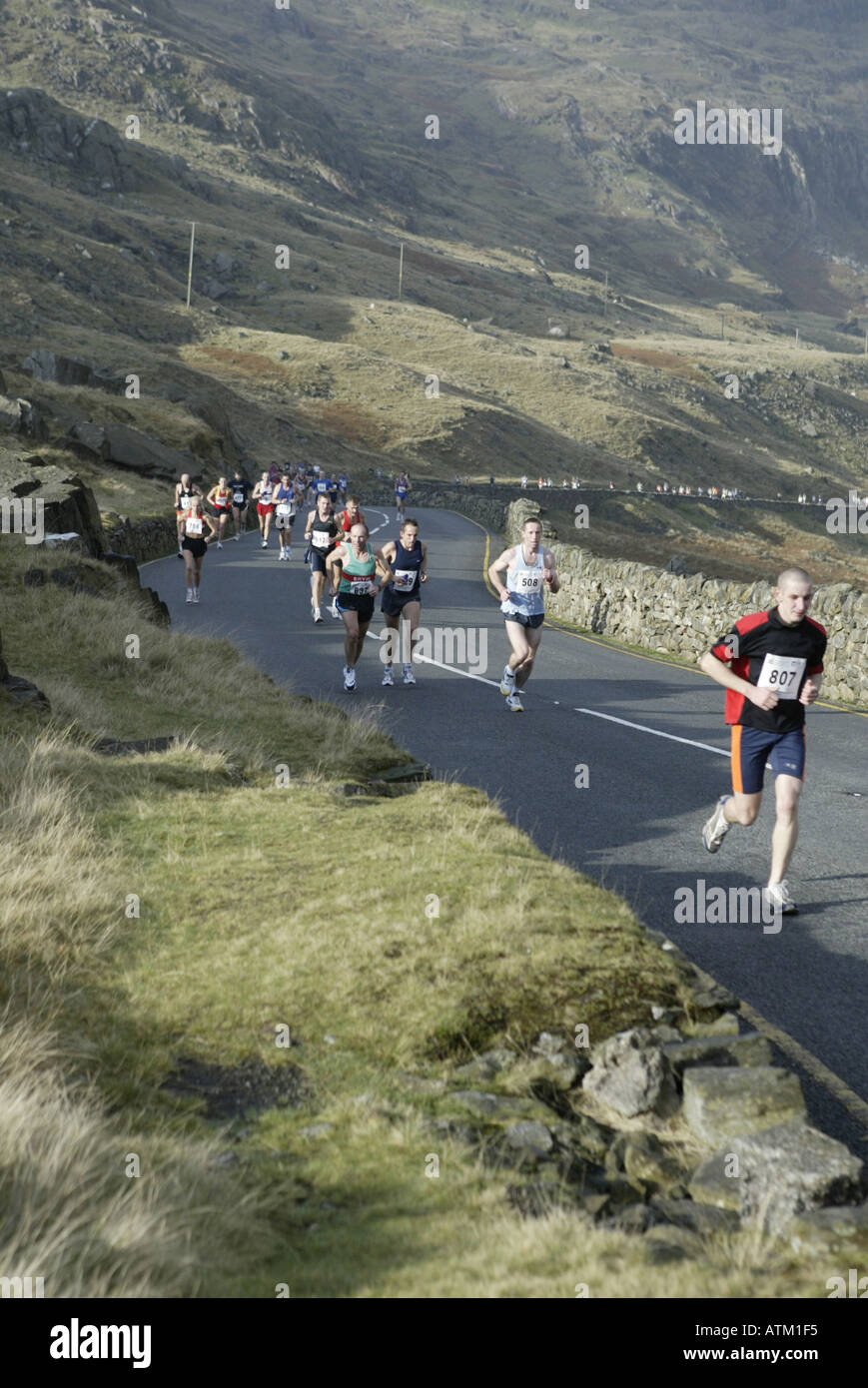 Runners in the 2004 Snowdon marathon complete the climb up from ...