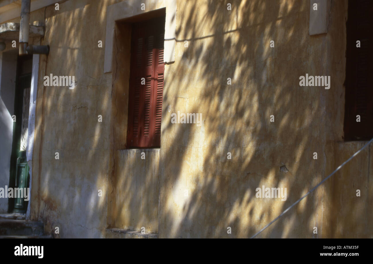 Dappled sunlight on wall with shutters number 1826 Stock Photo - Alamy
