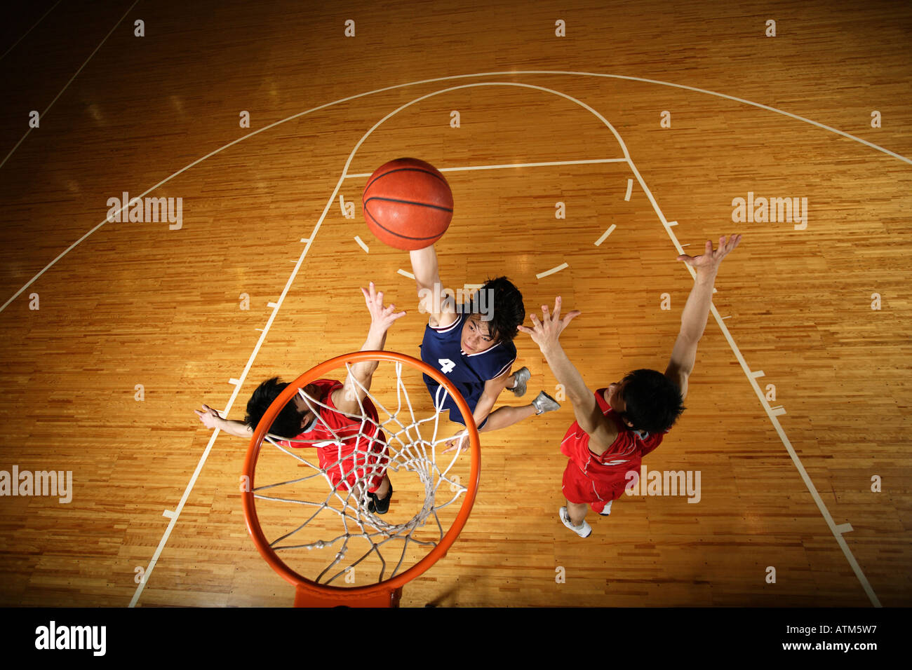 Young Asian basketball players on court Stock Photo - Alamy