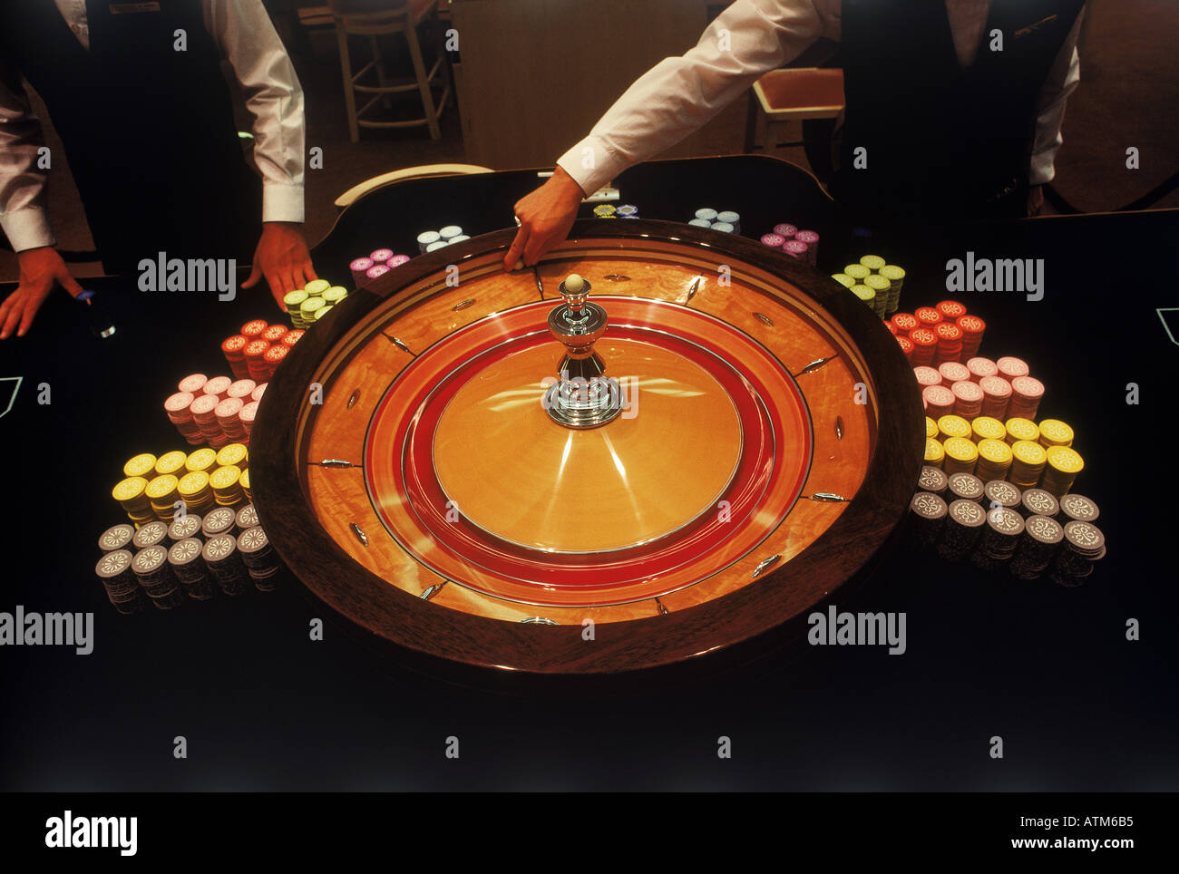 Spinning roulette wheel with chips Stock Photo - Alamy