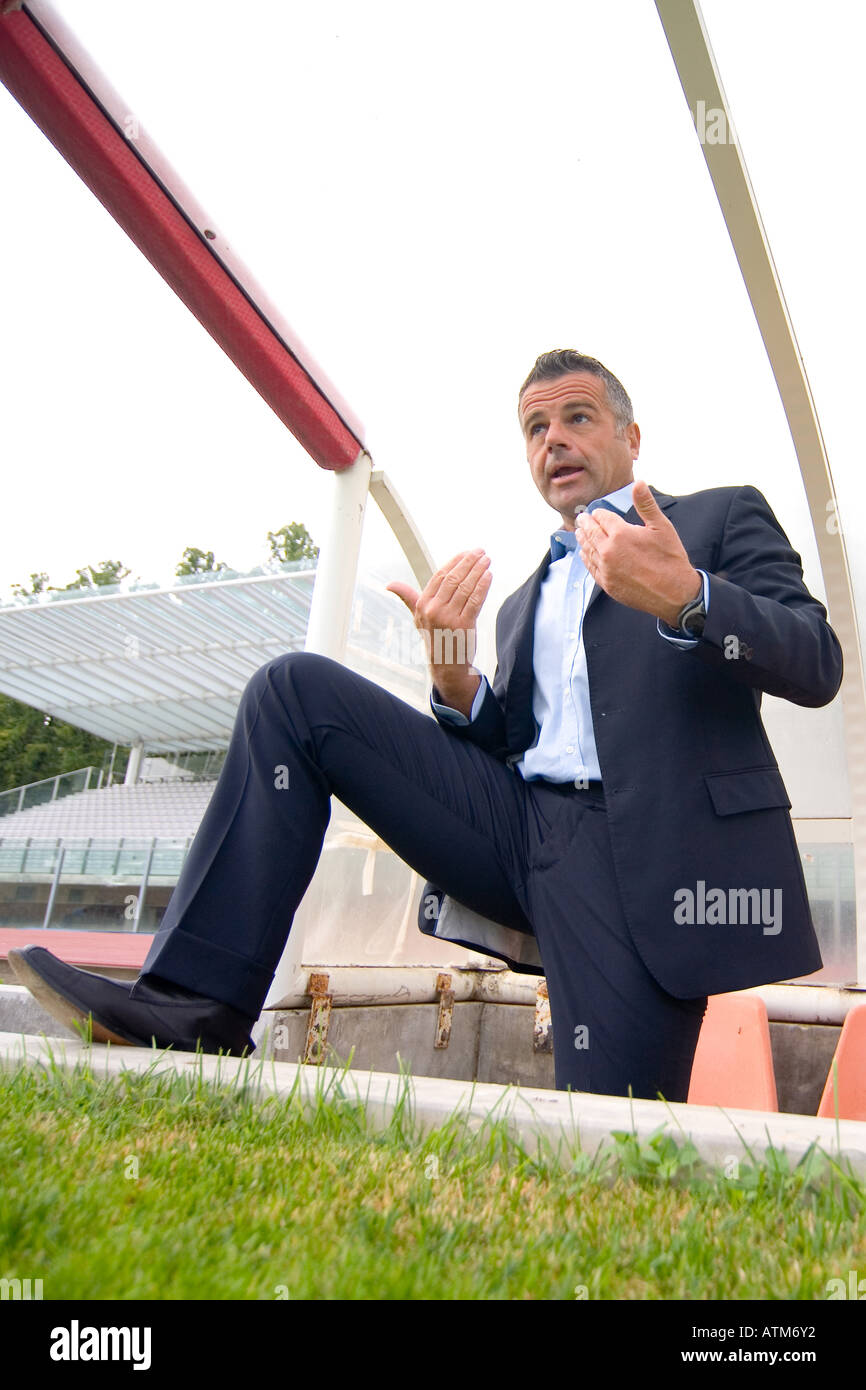 Man in suit looking challenging Stock Photo - Alamy