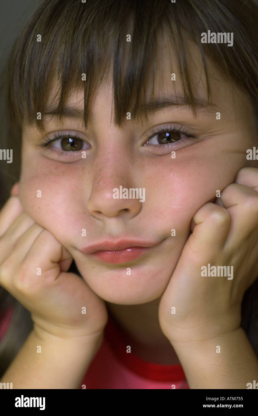 girl with hands on face Stock Photo - Alamy