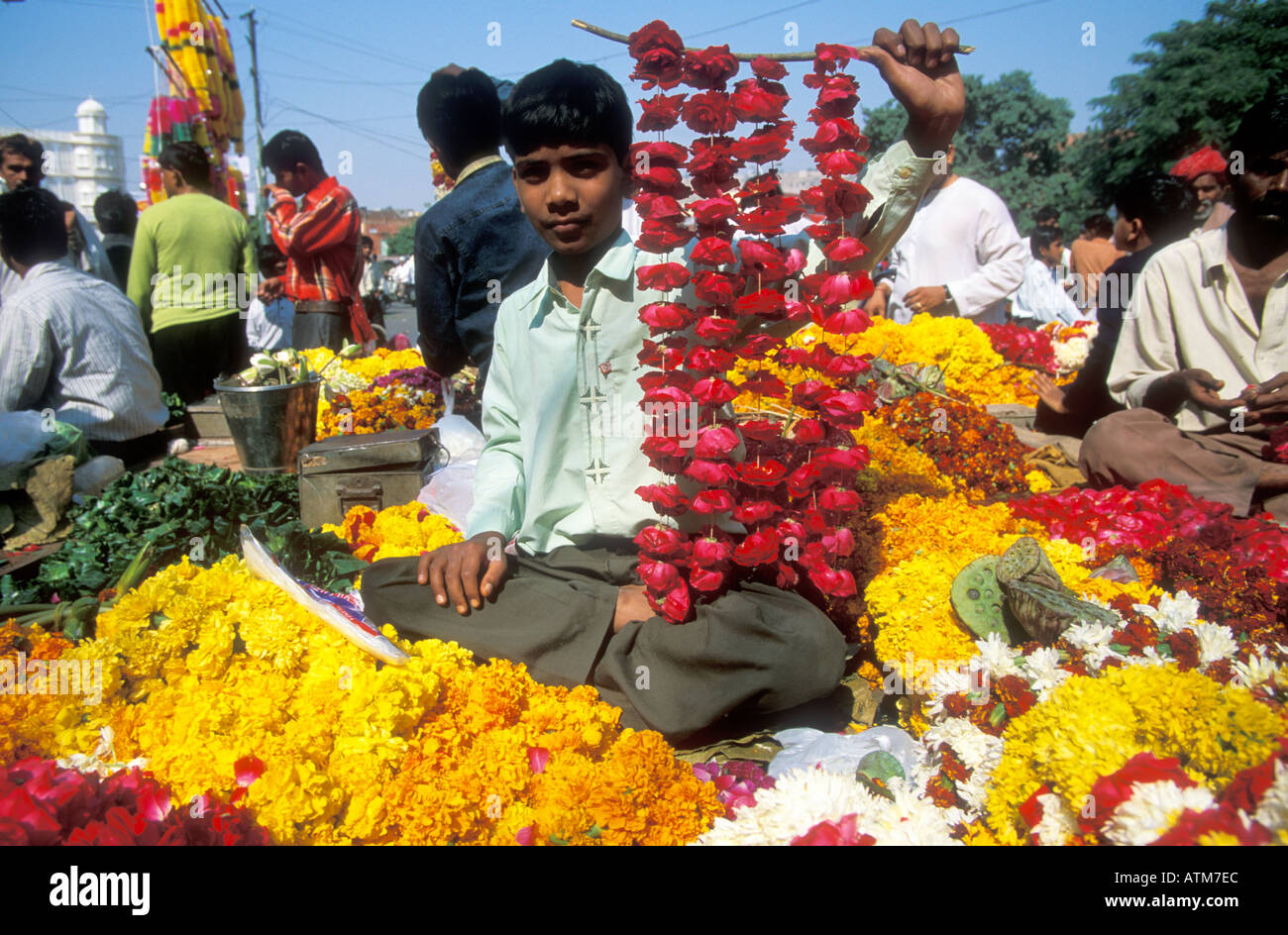 Indian boy selling flowers hi-res stock photography and images - Alamy