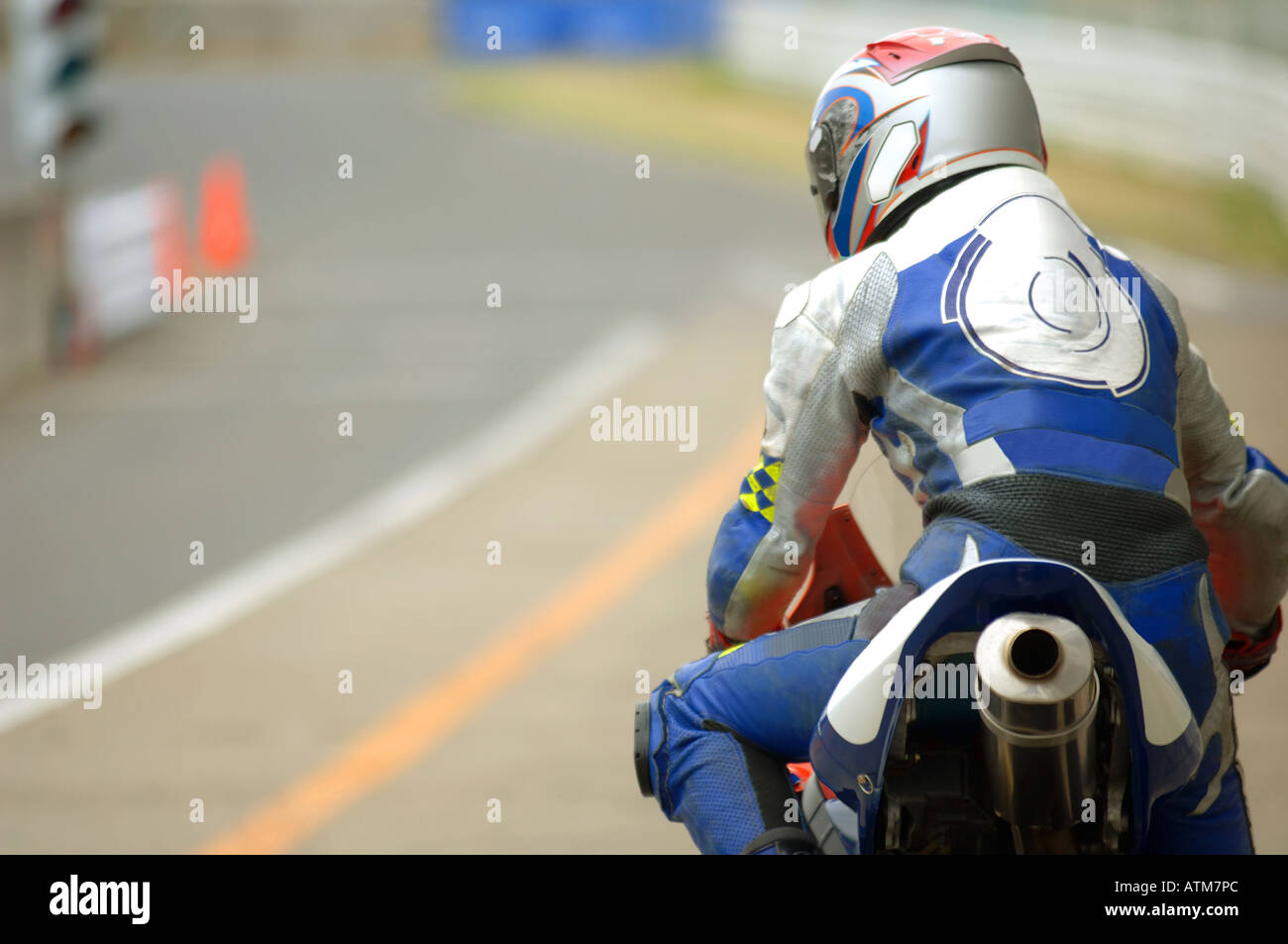 Rear view of racing motor biker on motorcycle Stock Photo - Alamy