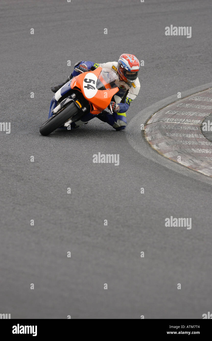 Racing motor bike cornering at speed Stock Photo - Alamy
