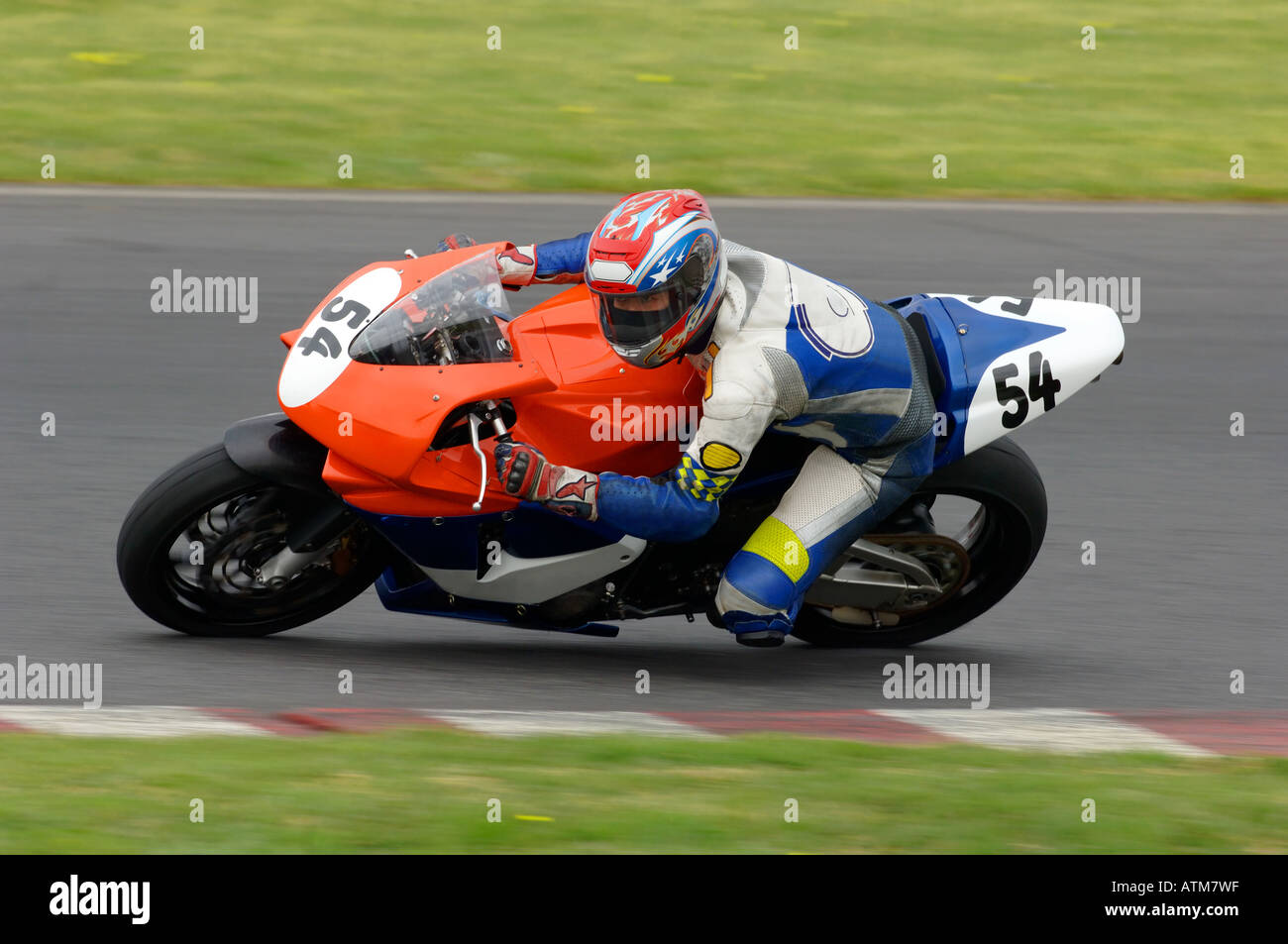 Racing motor bike cornering Stock Photo - Alamy