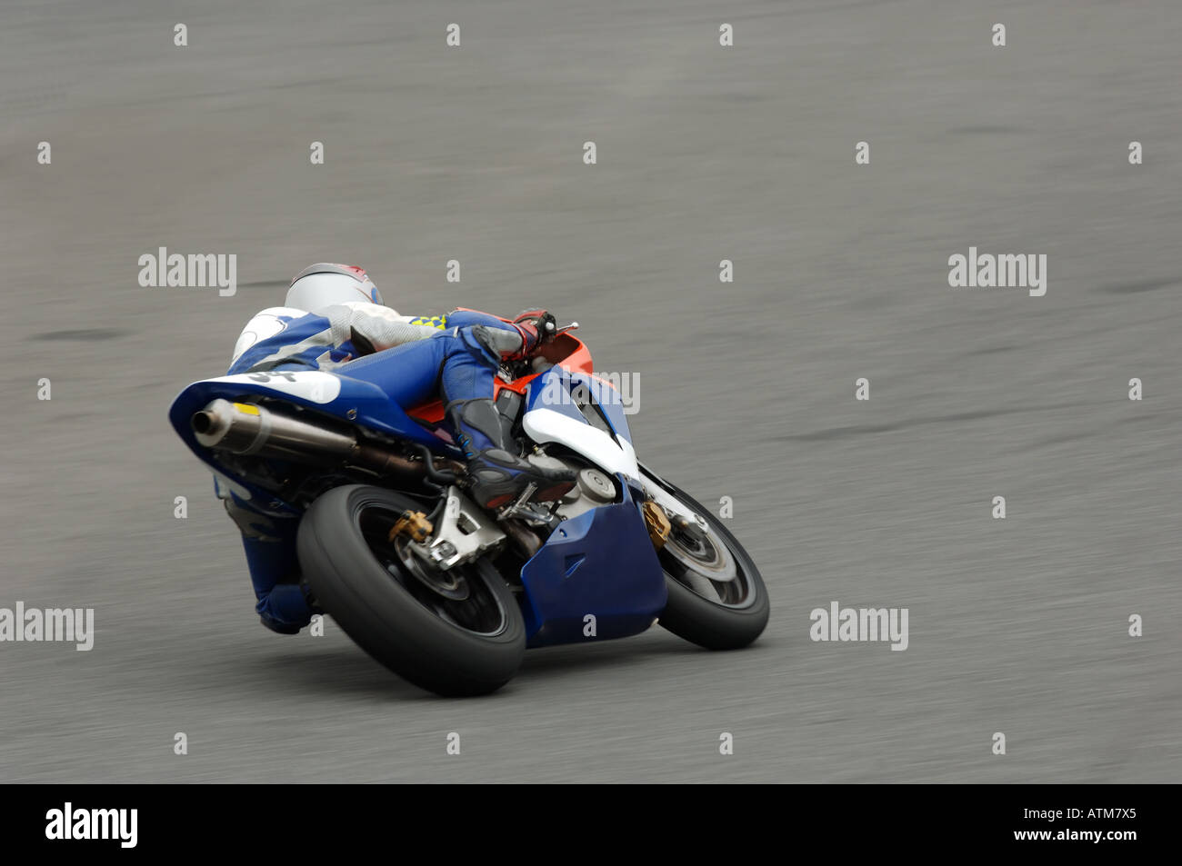 Racing motor bike cornering at speed Stock Photo - Alamy