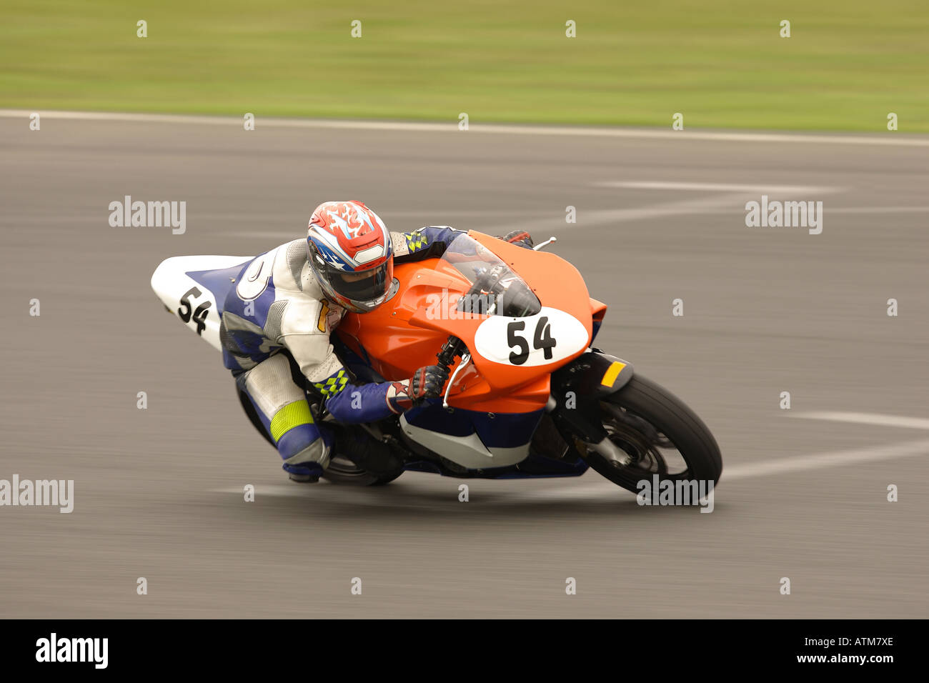 Racing motor bike cornering at speed Stock Photo - Alamy