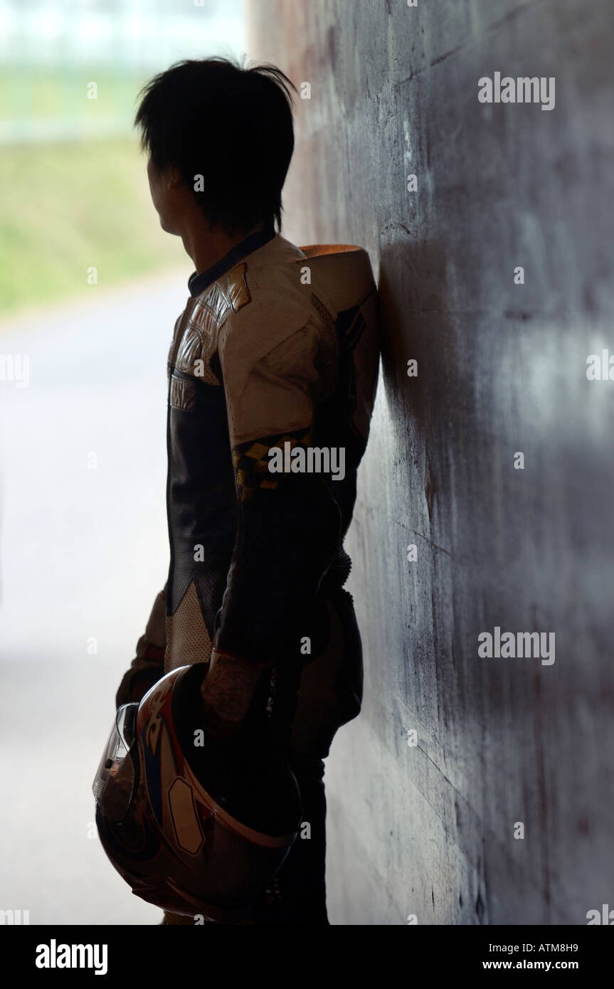 Rear profile of racing motor biker standing by wall Stock Photo - Alamy