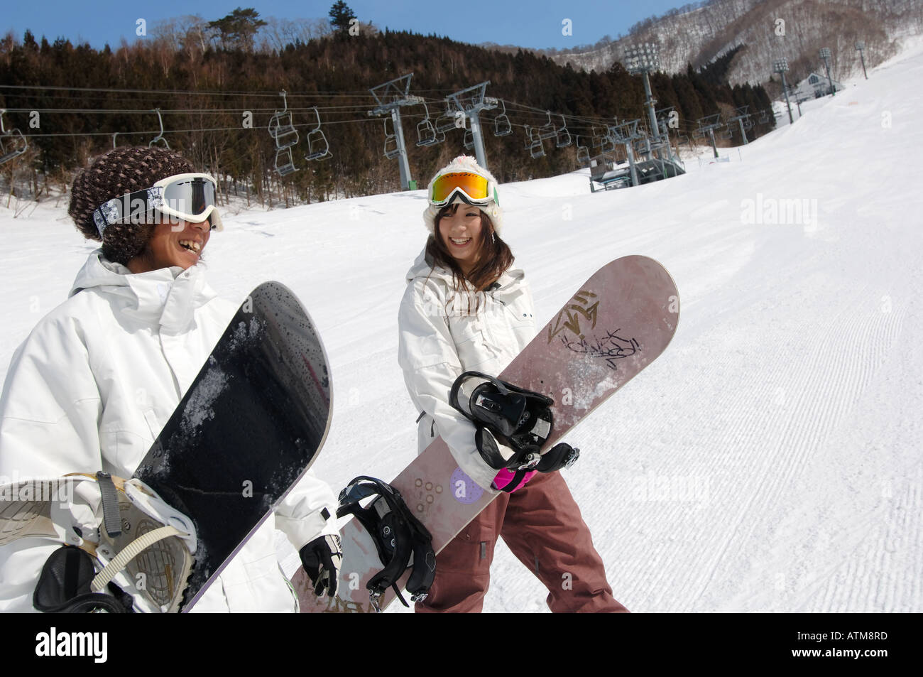 Young japanese woman snowboarding hi-res stock photography and images ...