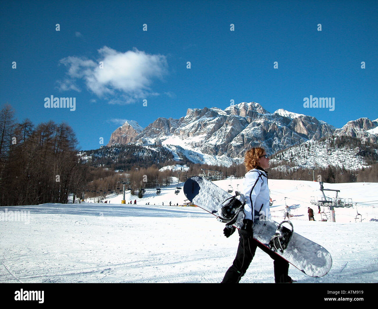 GIRL WITH SNOWBOARD CROSSING SLOPE Stock Photo - Alamy
