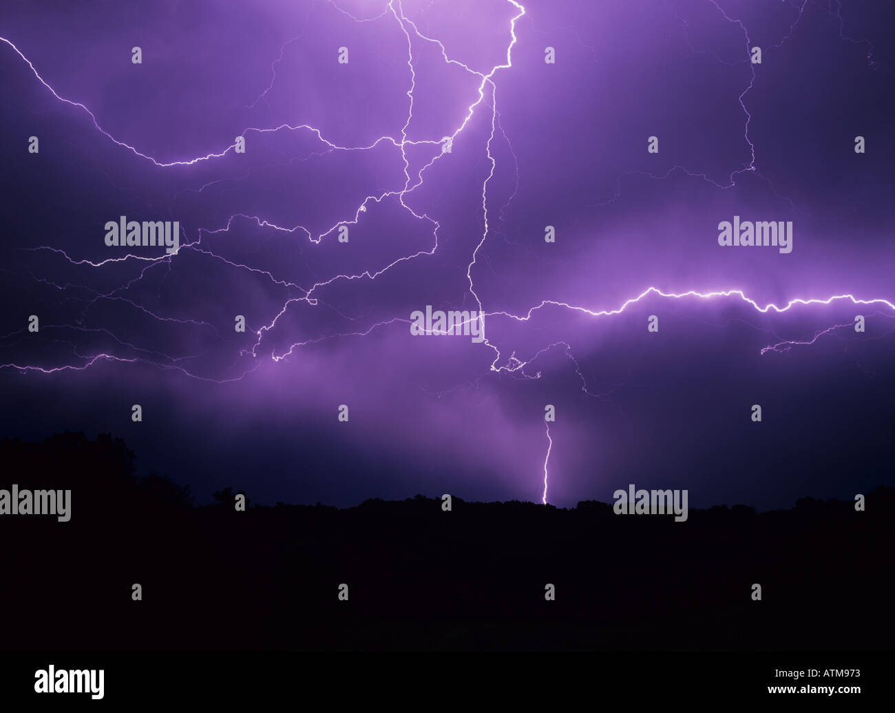 A huge lightning bolt lights the night sky during a supercell ...