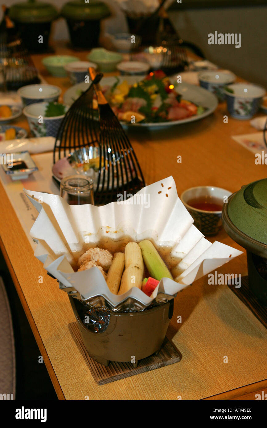 Traditional Japanese food is cooked at the table in this restaurant ...