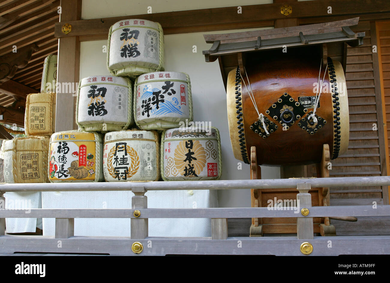 Large sake barrels next to a large traditional taiko drum at Kumano ...