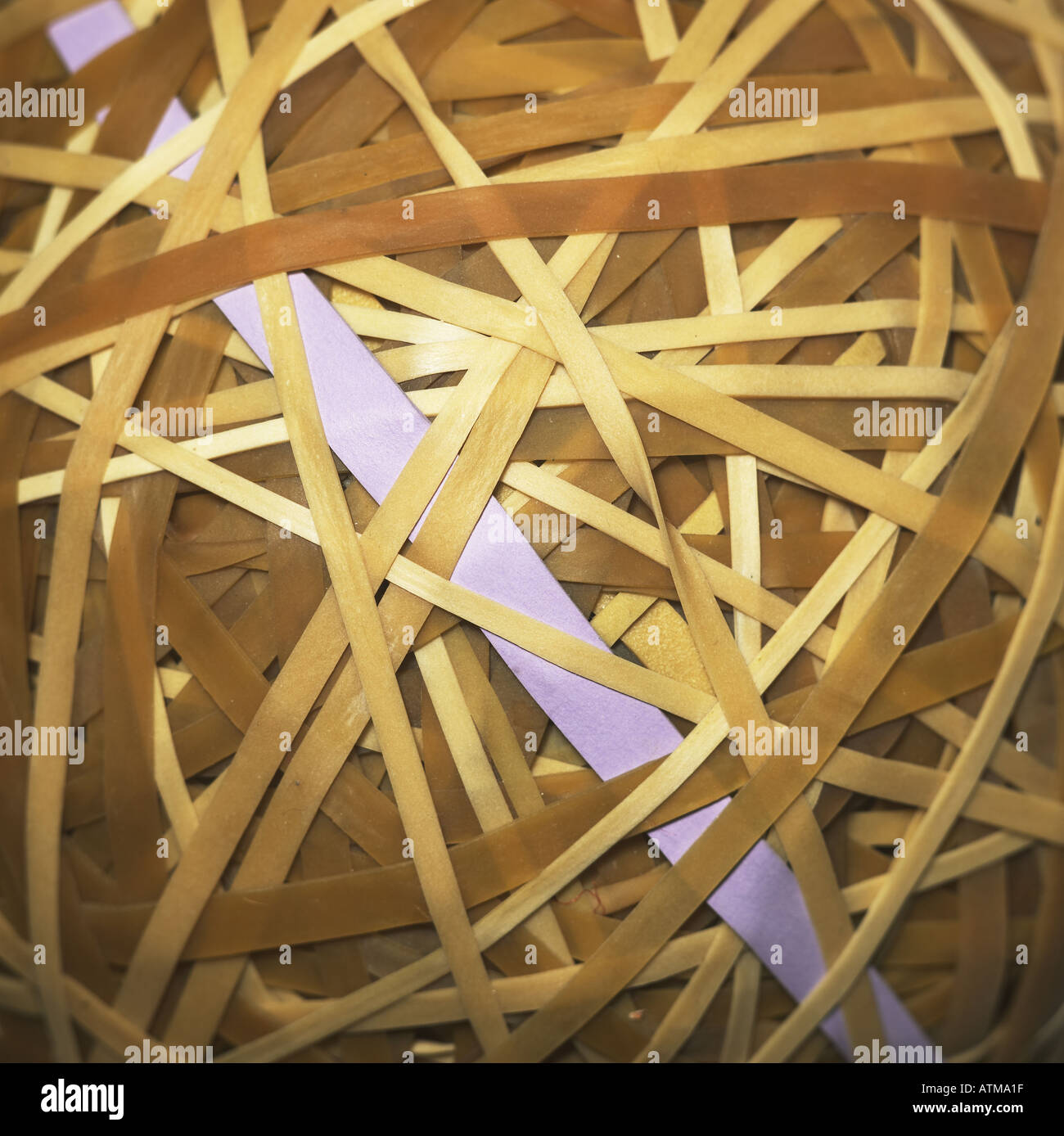 Rubber band ball close up showing the inter woven strands of rubber ...