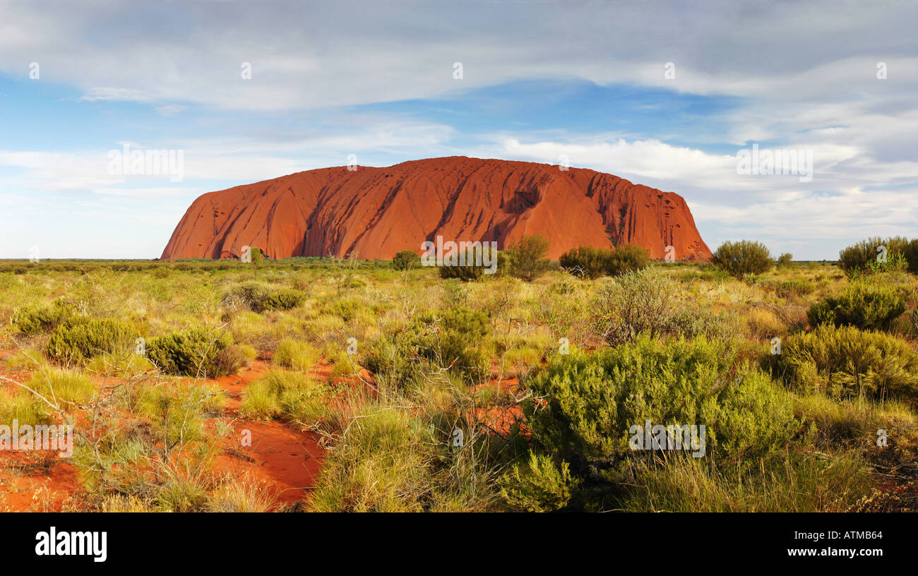 Iconic evocative view of Ayers rock Uluru at sunset with atmospheric ...