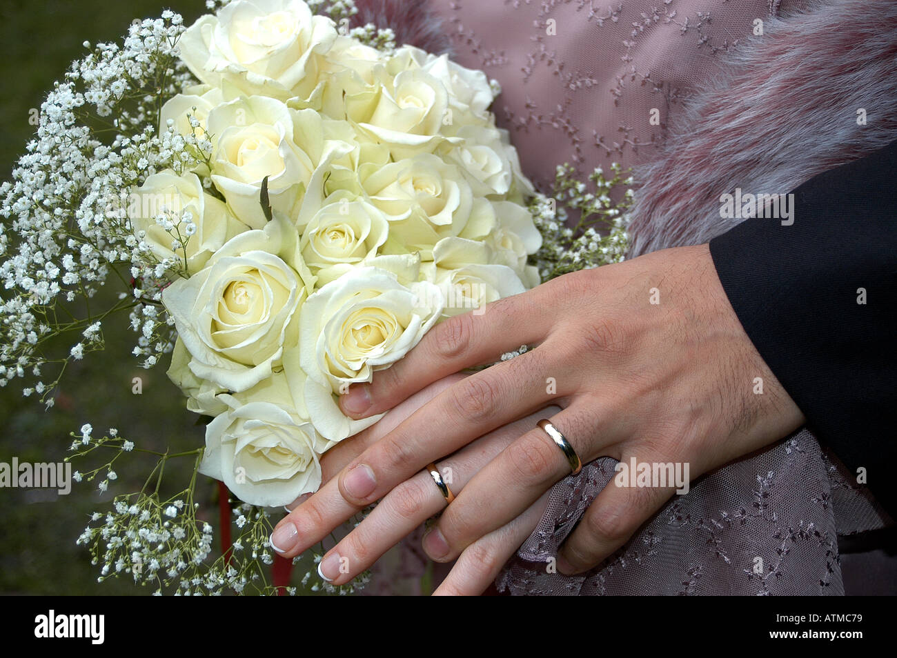 Wedding couple showing hands flowers hi-res stock photography and ...