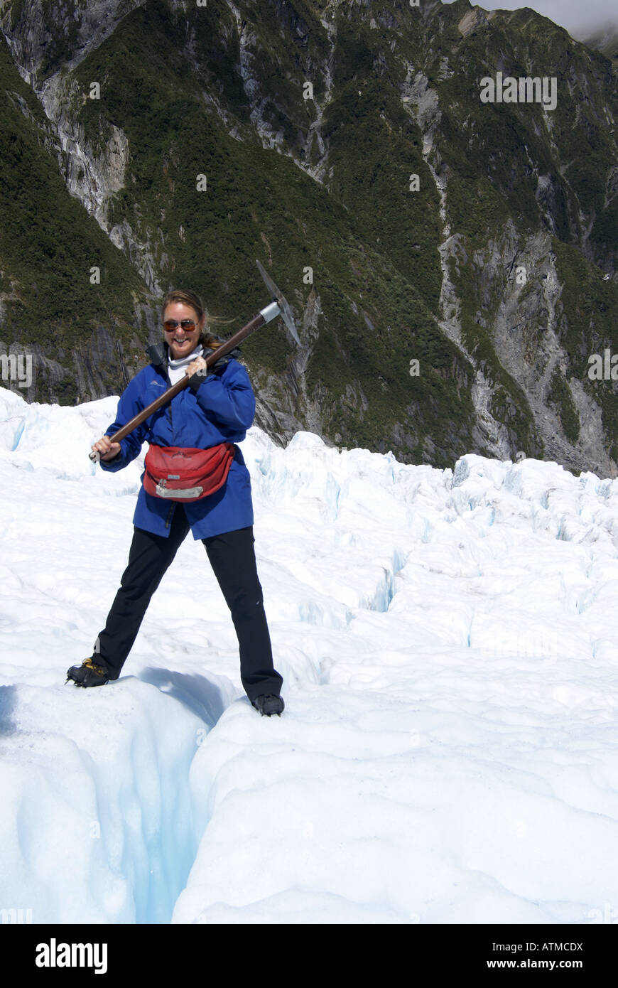 Juliet astride a crevasse on Franz Josef glacier Stock Photo - Alamy