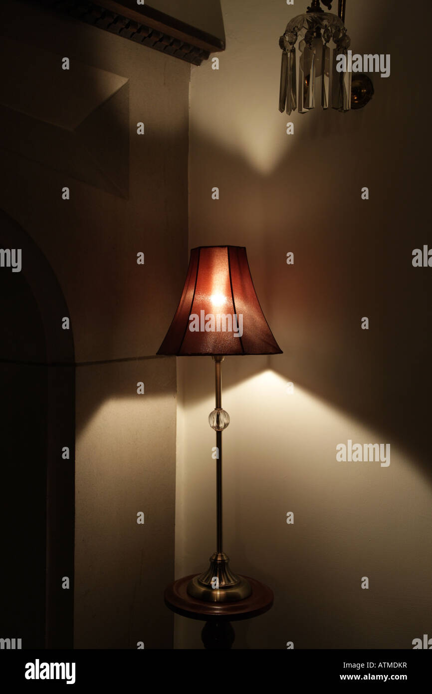 An unusual lamp lighting up a corner giving unusual shapes Stock Photo ...