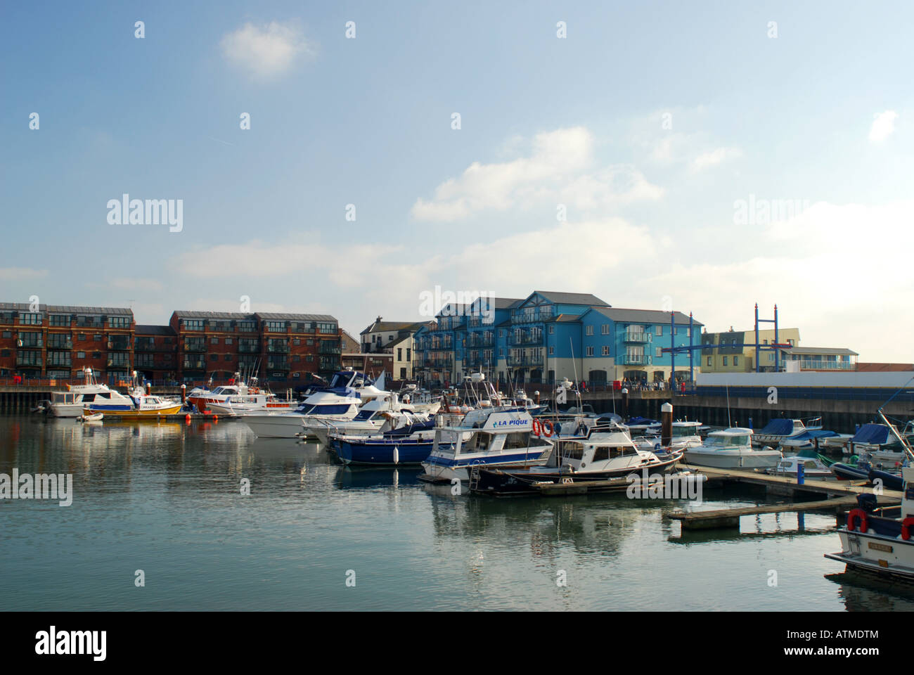 Boats of all shapes and sizes moored at Exmouth Marina Stock Photo - Alamy