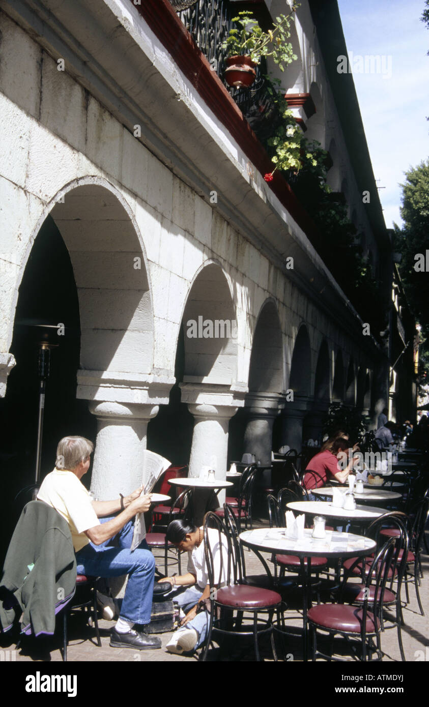 Town Plaza de Armas Colonnade Cafe Man seated Stock Photo - Alamy