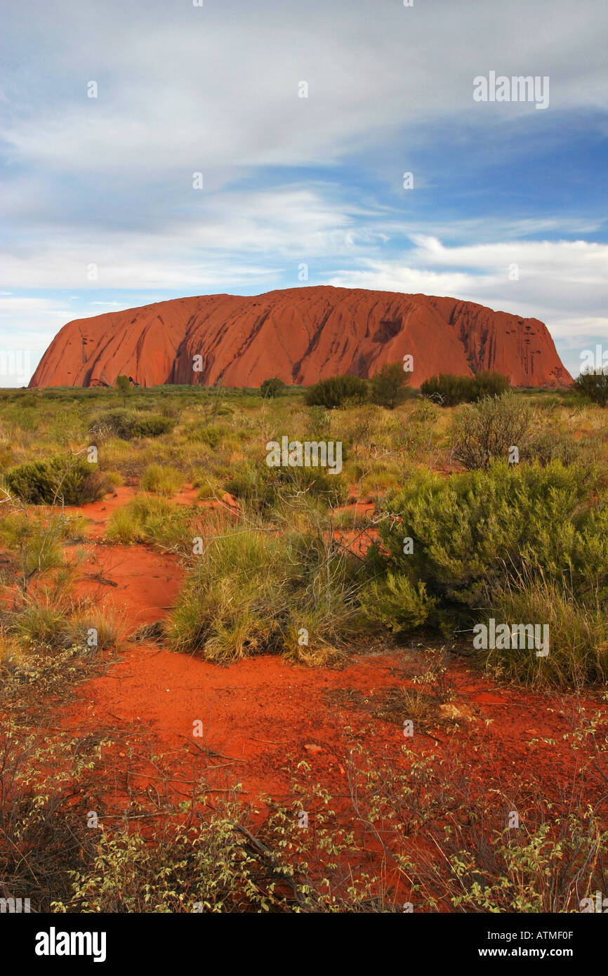 Uluru Ayers Rock glows red and orange at sunset in the Australian ...