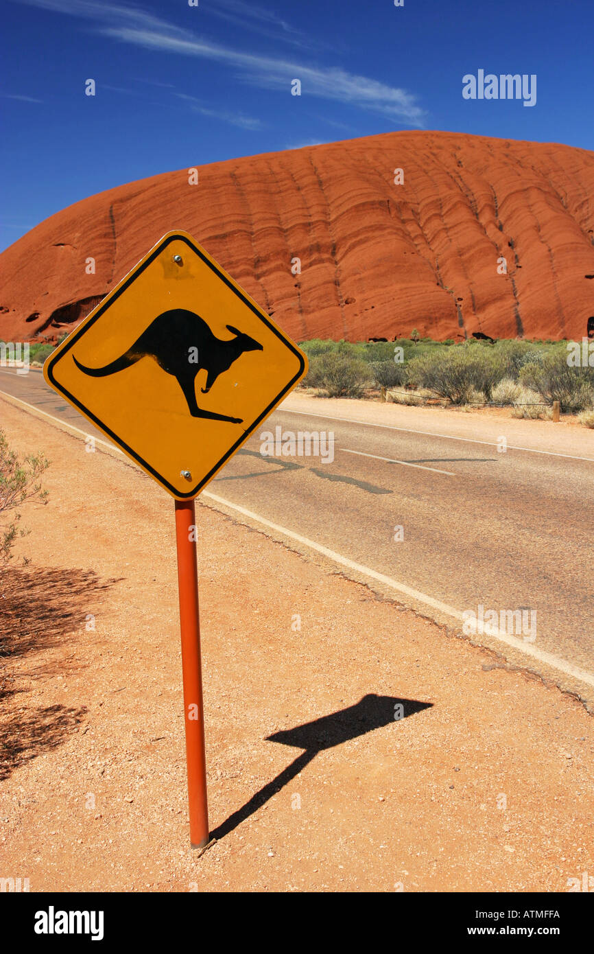 Classic iconic Kangaroo warning sign on the roadside next to Ayers rock ...