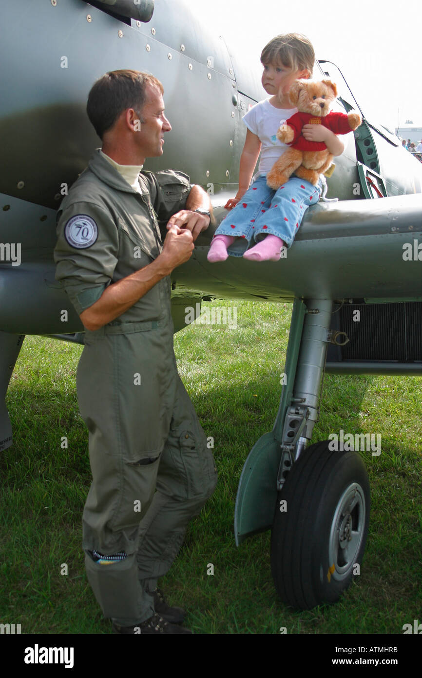 Spitfire pilot Dave Ratcliffe chatting with little girl sitting on the ...