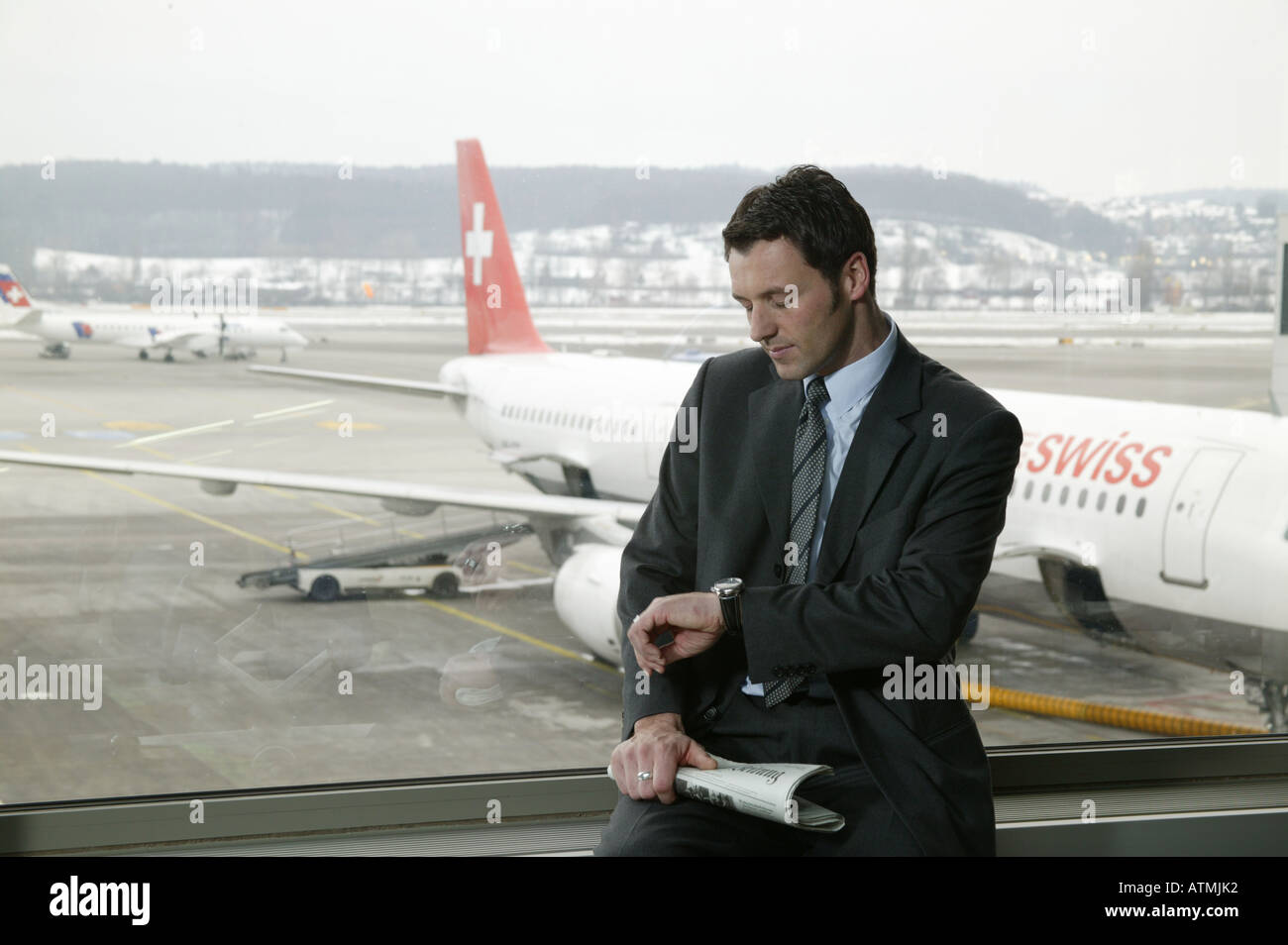 business man waiting at the airport Stock Photo - Alamy