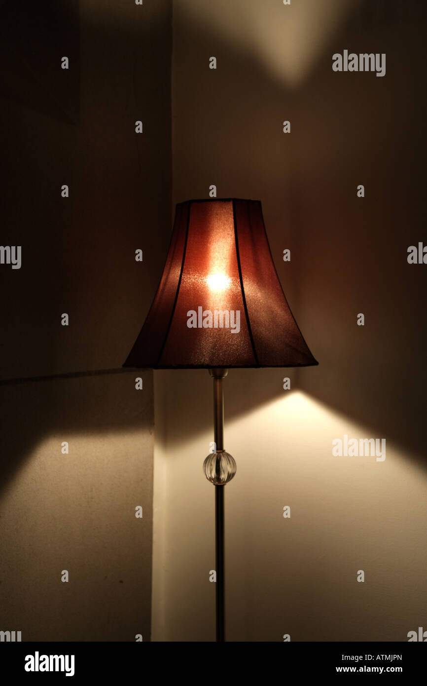 An unusual lamp lighting up a corner giving unusual shapes Stock Photo ...