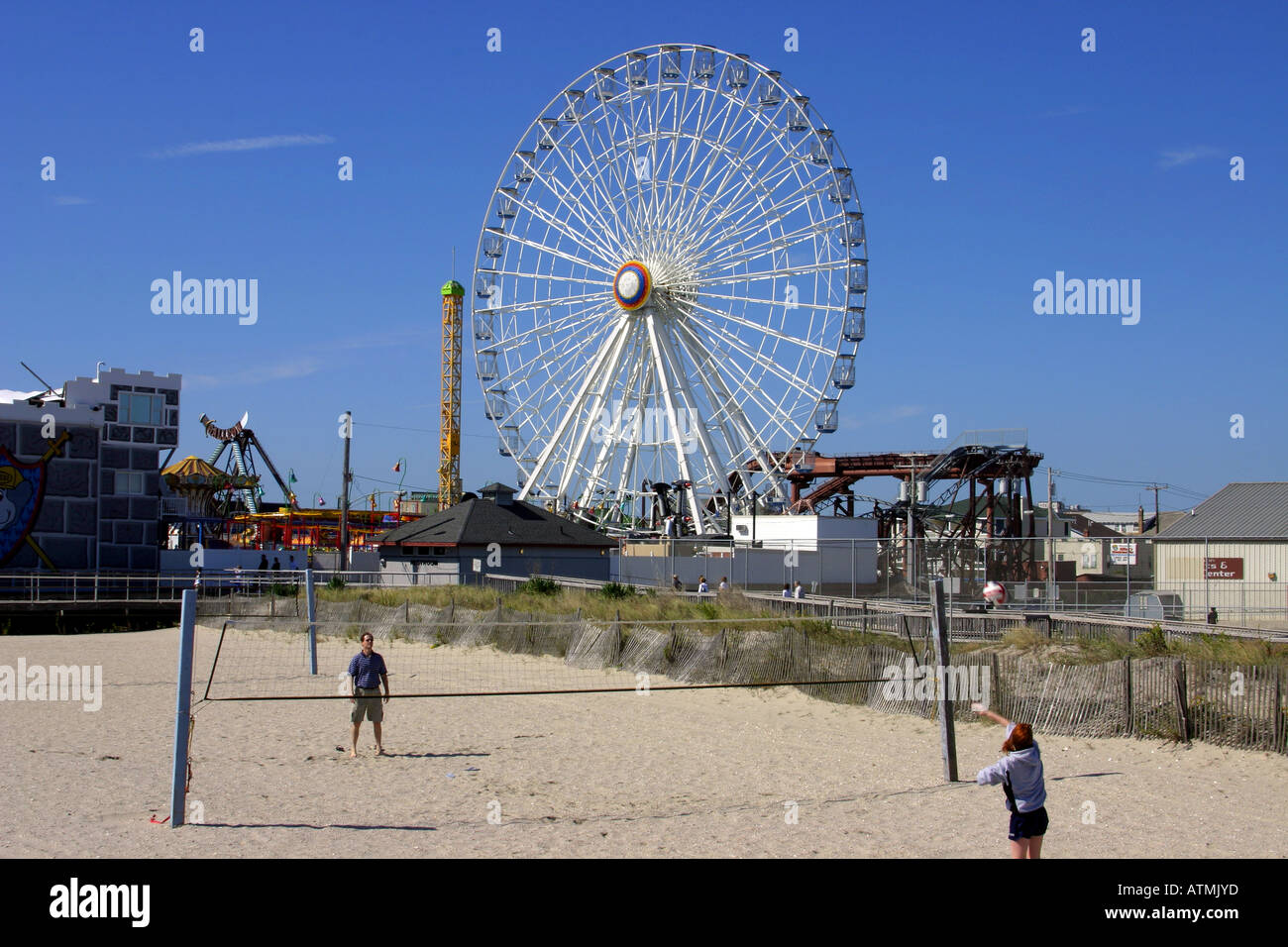 Ocean City Ferris Wheel and Volleyball Players Stock Photo - Alamy
