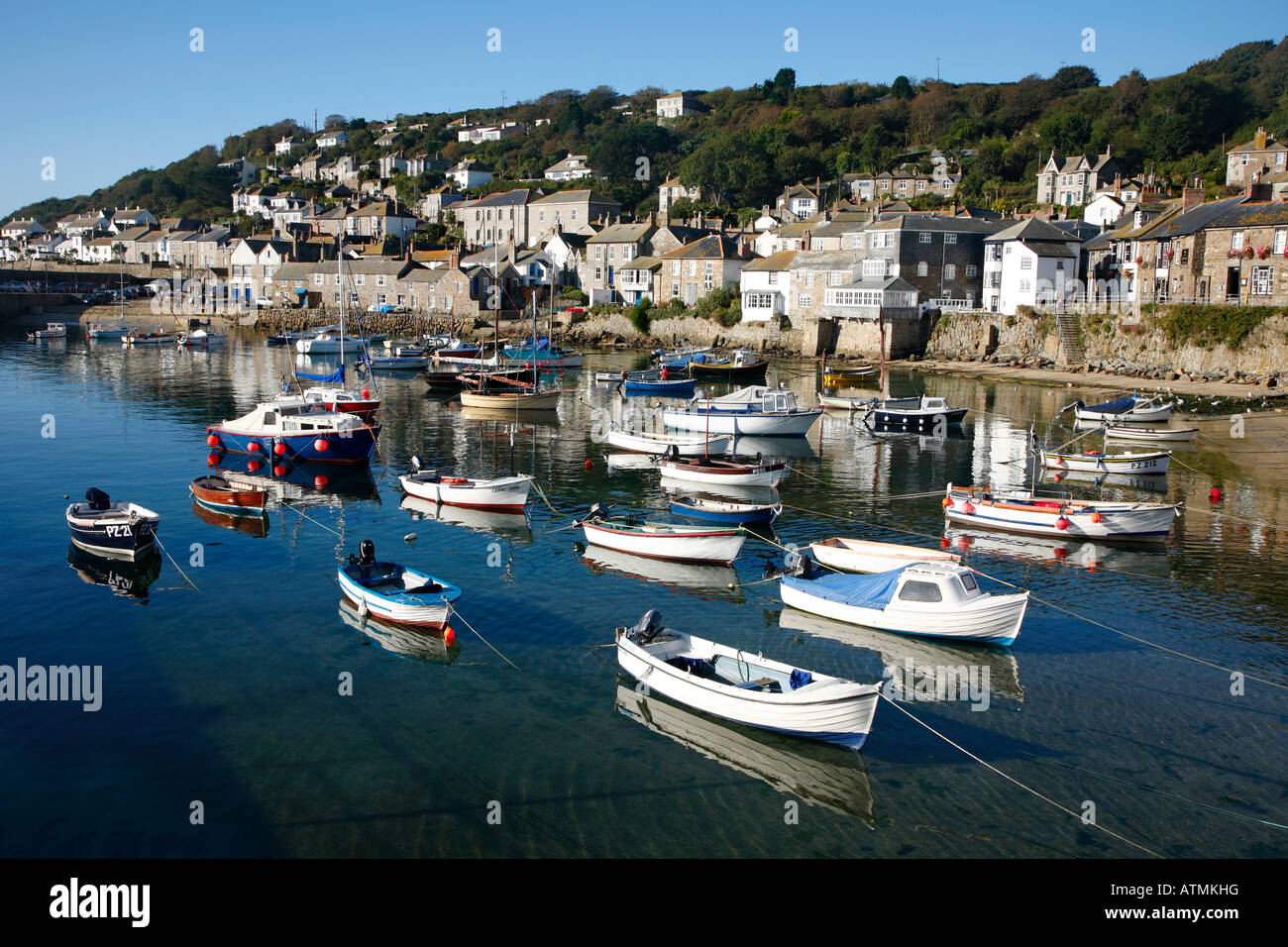 Boats floating in Mousehole harbour, Cornwall UK Stock Photo - Alamy