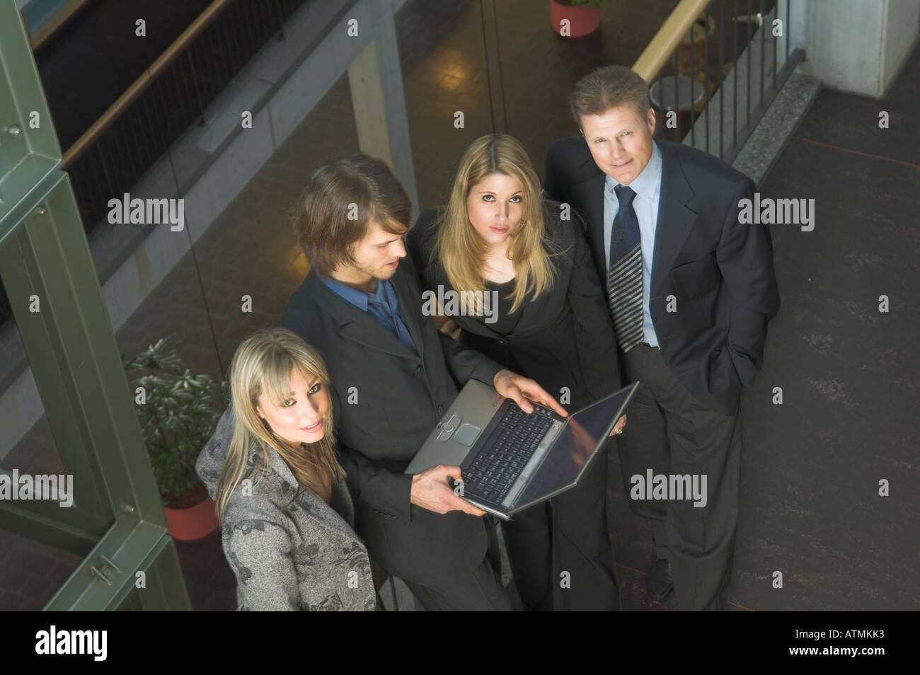 business people talking inside an office building Stock Photo - Alamy