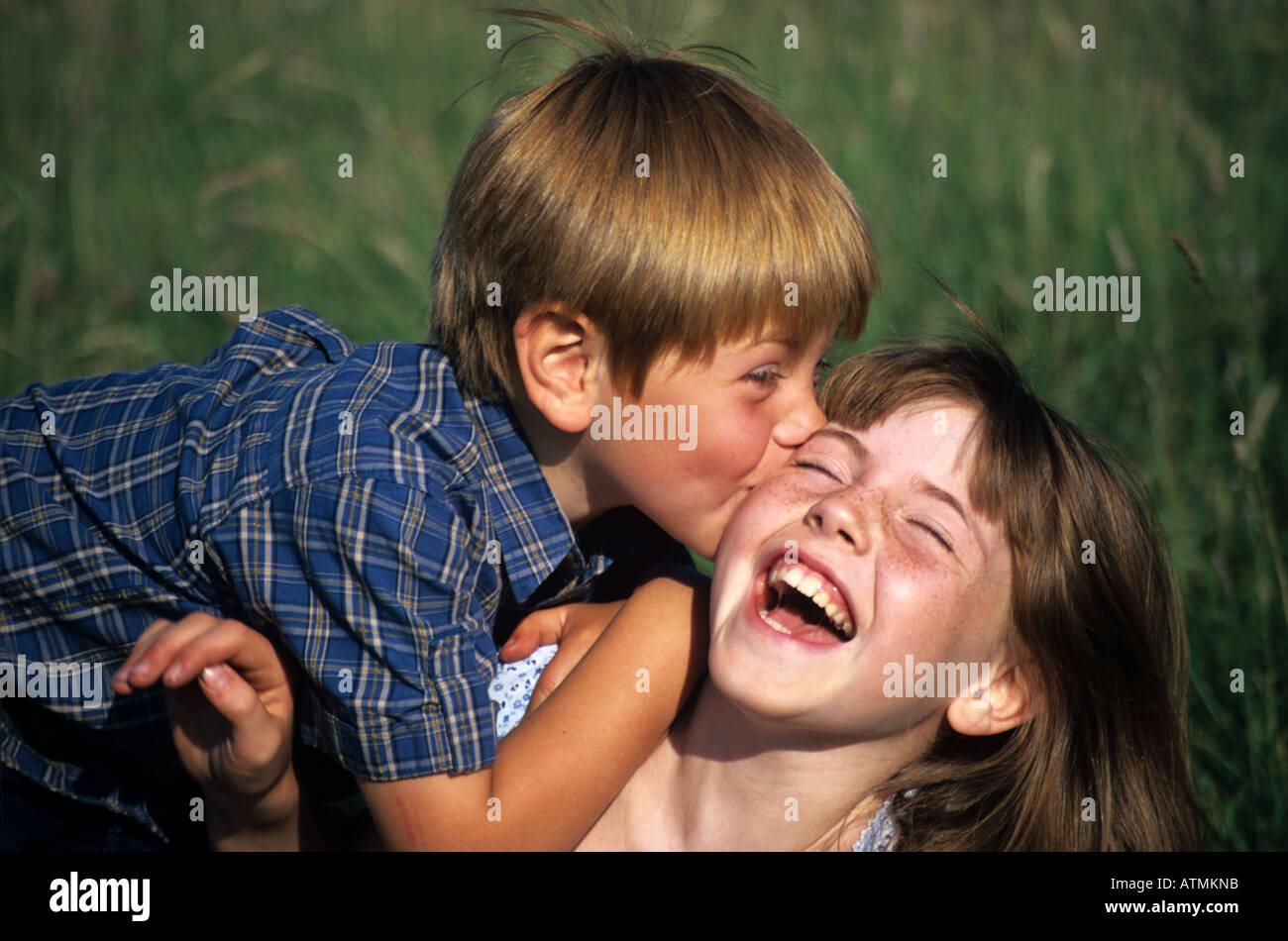 Children laughing and kissing Stock Photo - Alamy