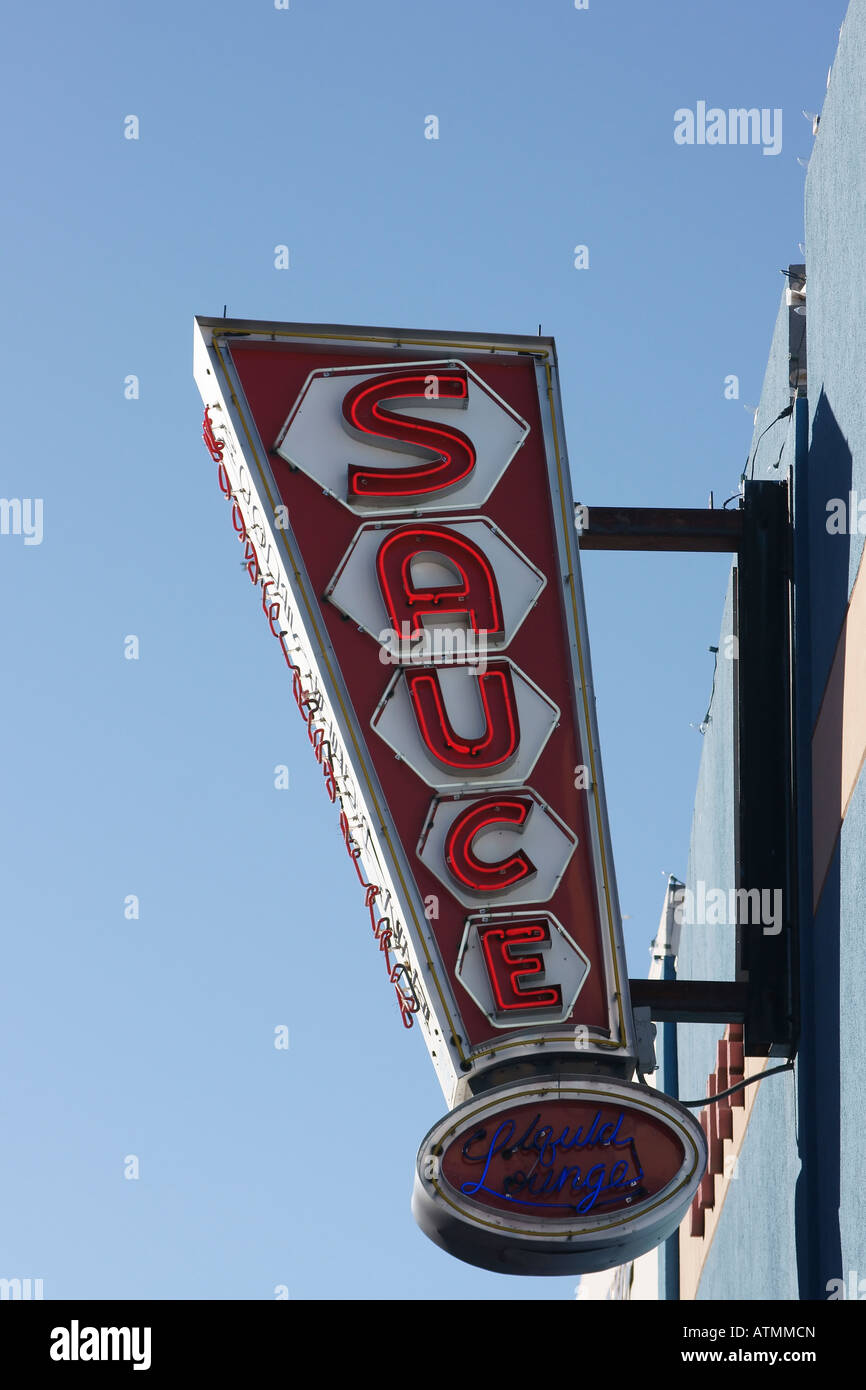 An old-style neon sign for a local bar Stock Photo - Alamy