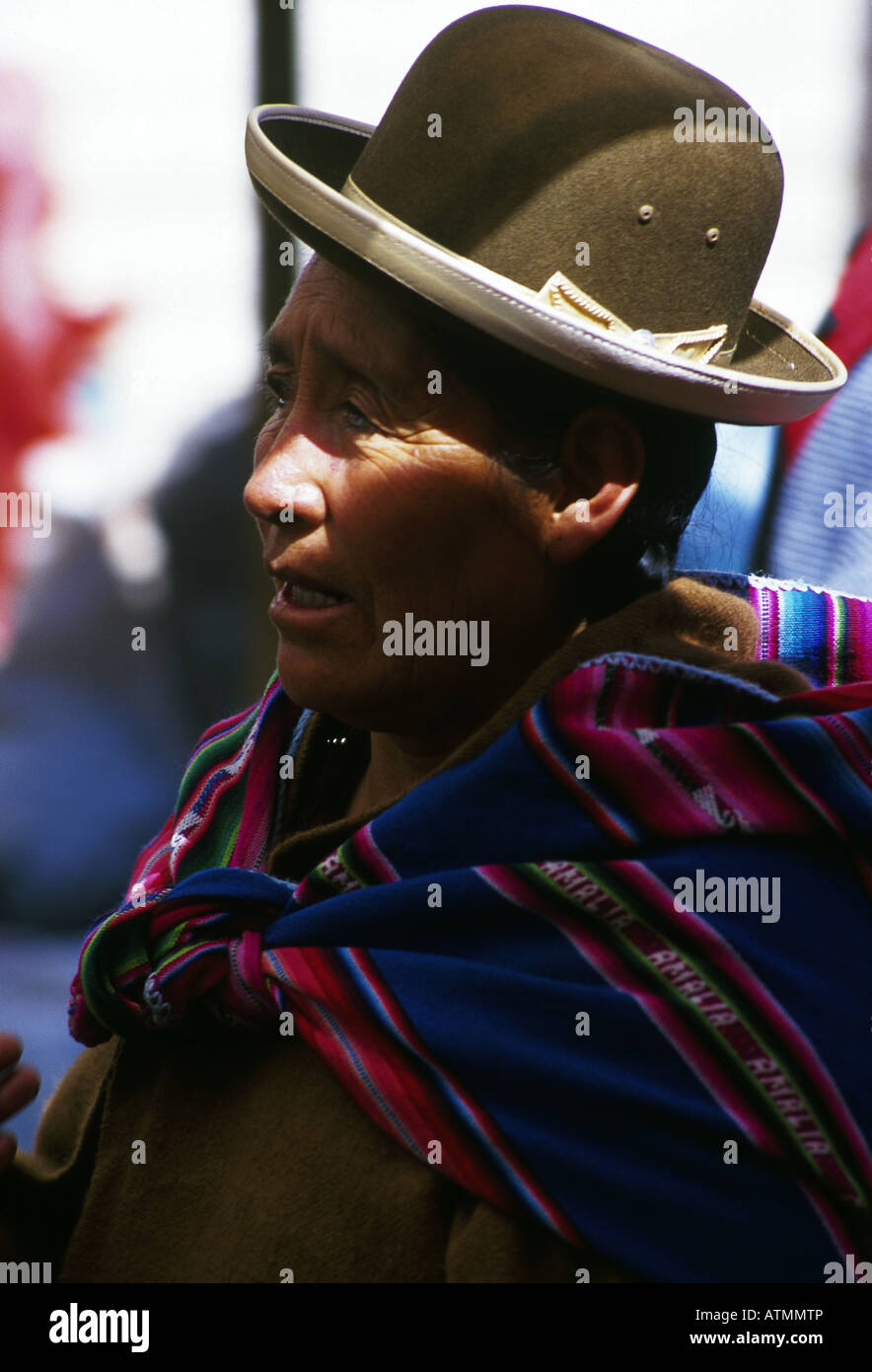 Woman in traditional Aymara dress Brown bowler hat felt hat Striped ...