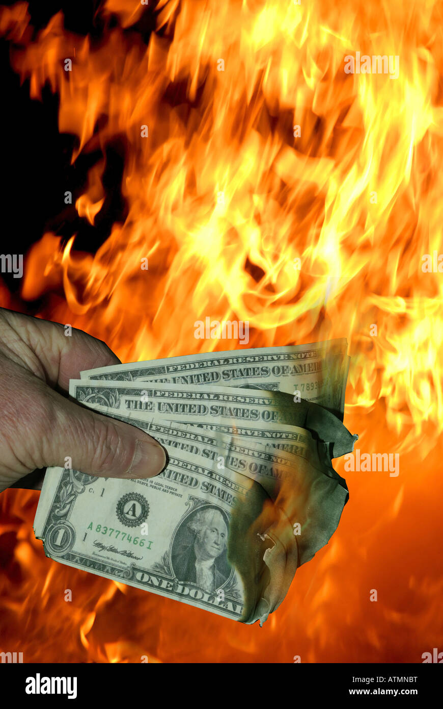 Dollar bills burning in flames hi-res stock photography and images - Alamy