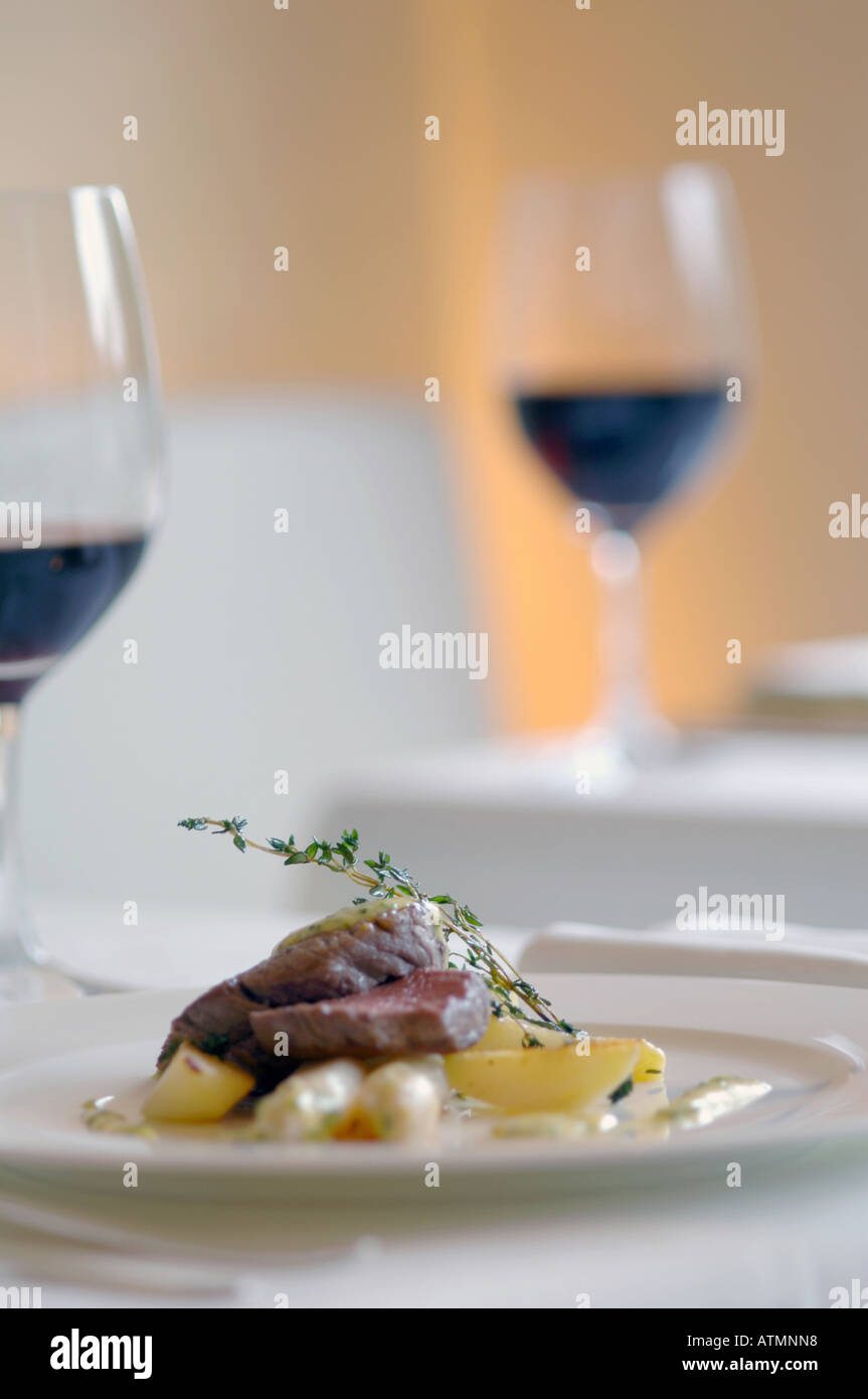 food and red wine on a nicely set table Stock Photo - Alamy