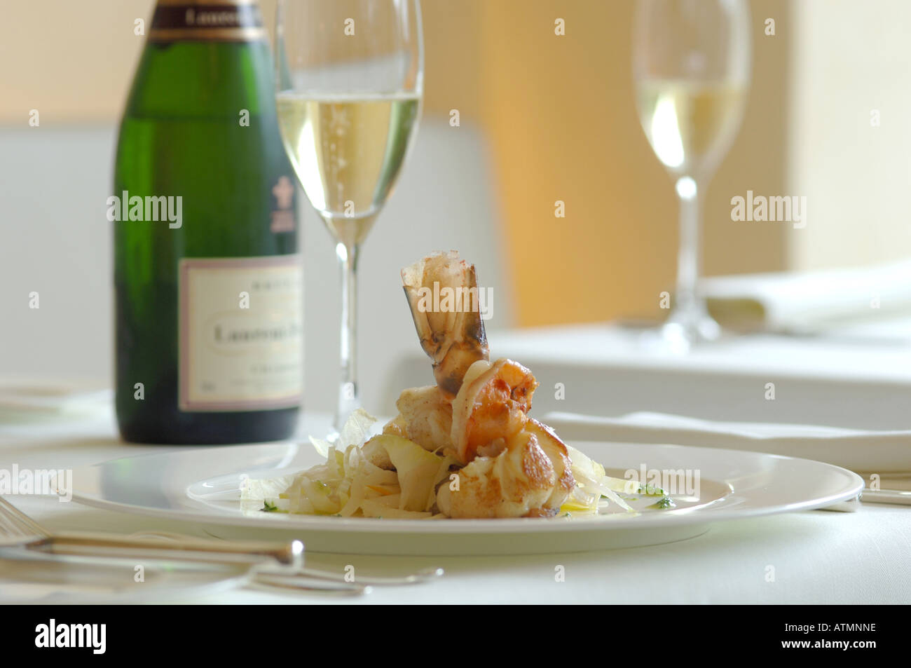 food and champagne on a nicely set table Stock Photo - Alamy