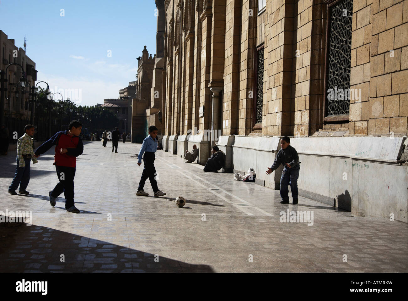 Kids are playing football by the Khan El-Khalil mosque in Cairo Stock ...