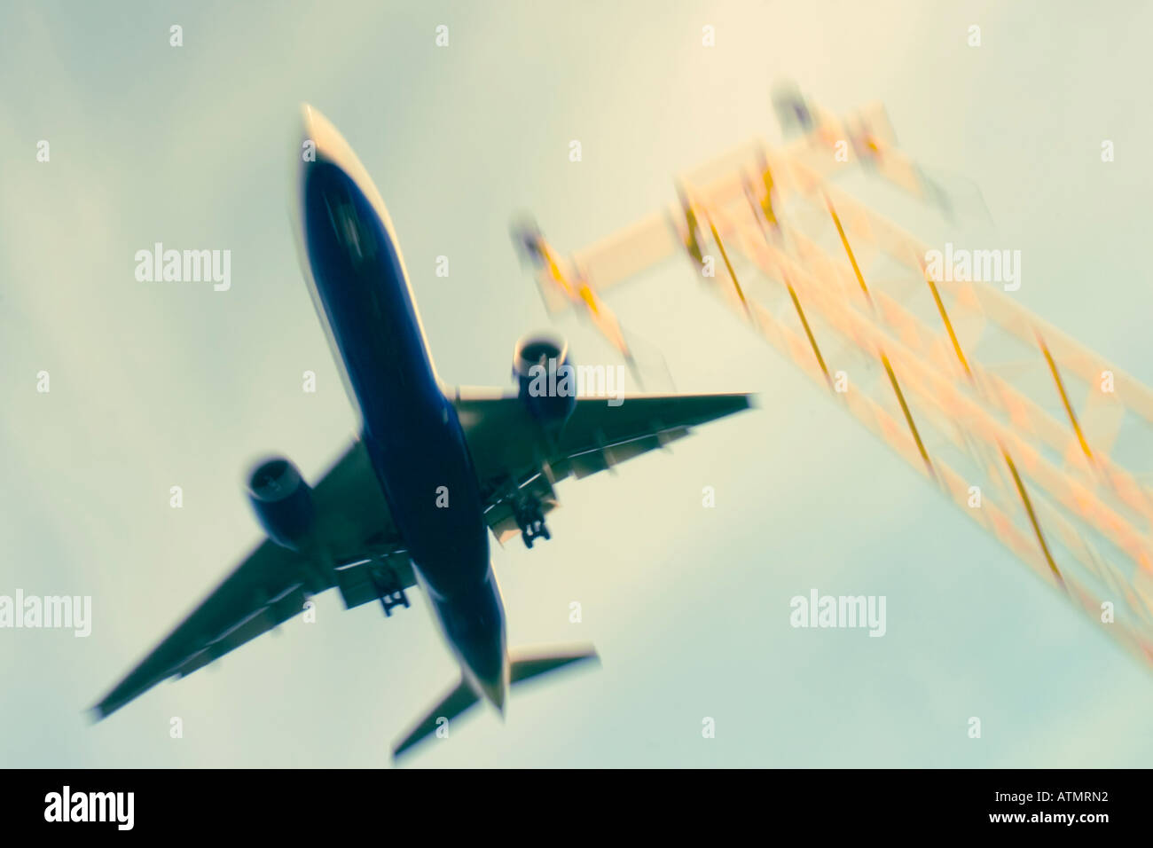 Low angle view of commercial aircraft flying over approach lights Stock ...