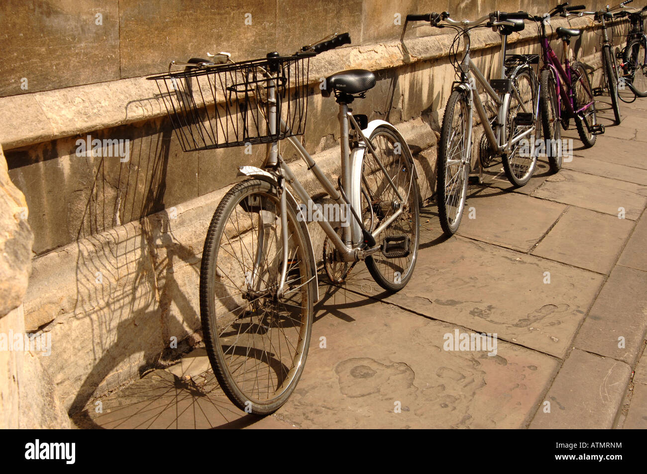 Bicycles against a wall Stock Photo - Alamy