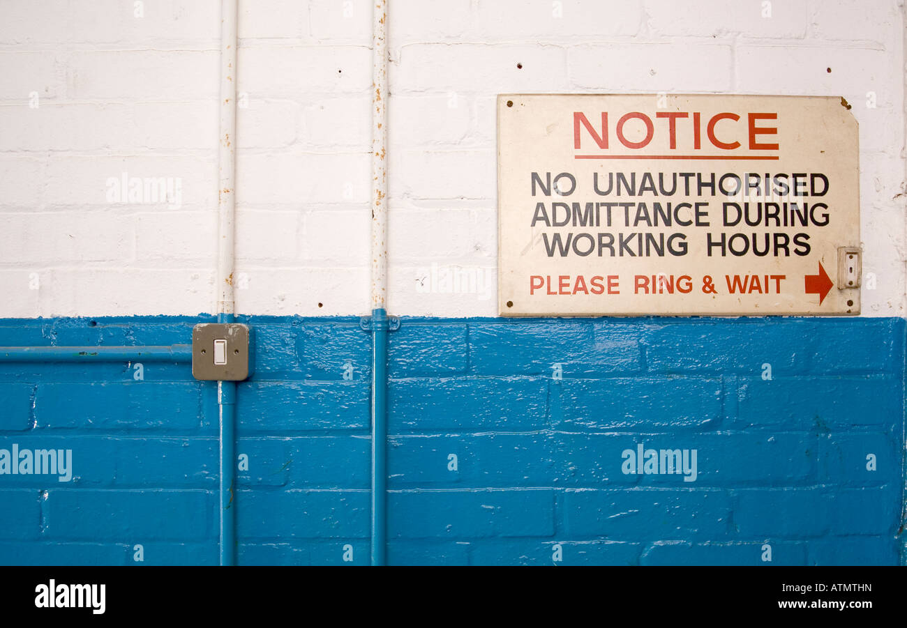 warning notice in old industrial building Stock Photo - Alamy