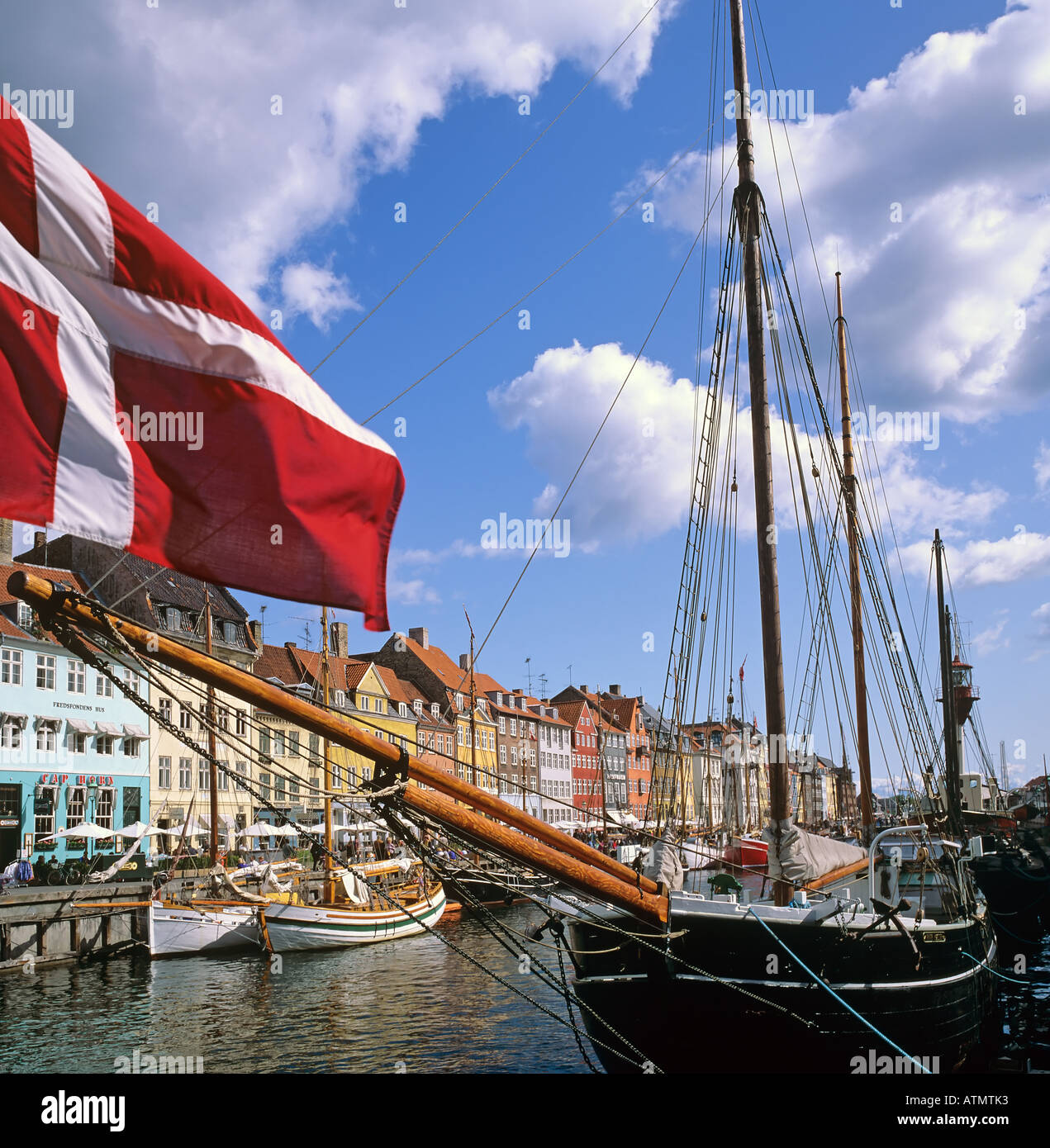 Danish flag and moored sailboats, Nyhavn, Copenhagen, Denmark, Europe ...
