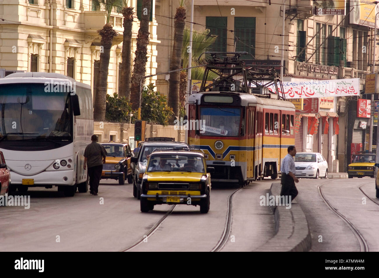 Tram and taxi on main street of Alexandria Egypt Stock Photo - Alamy