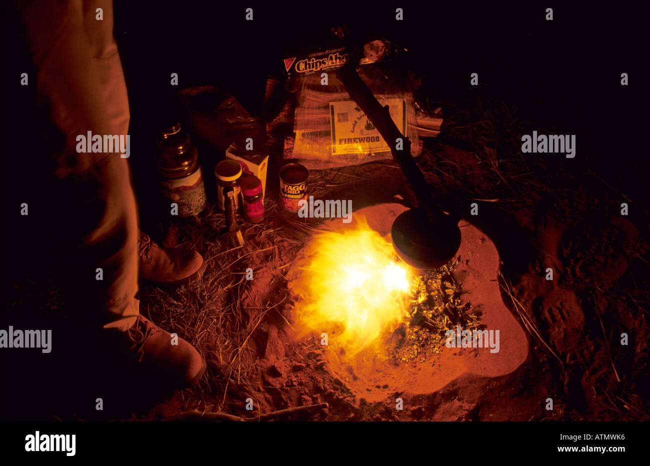 Man standing near camp fire hi-res stock photography and images - Alamy