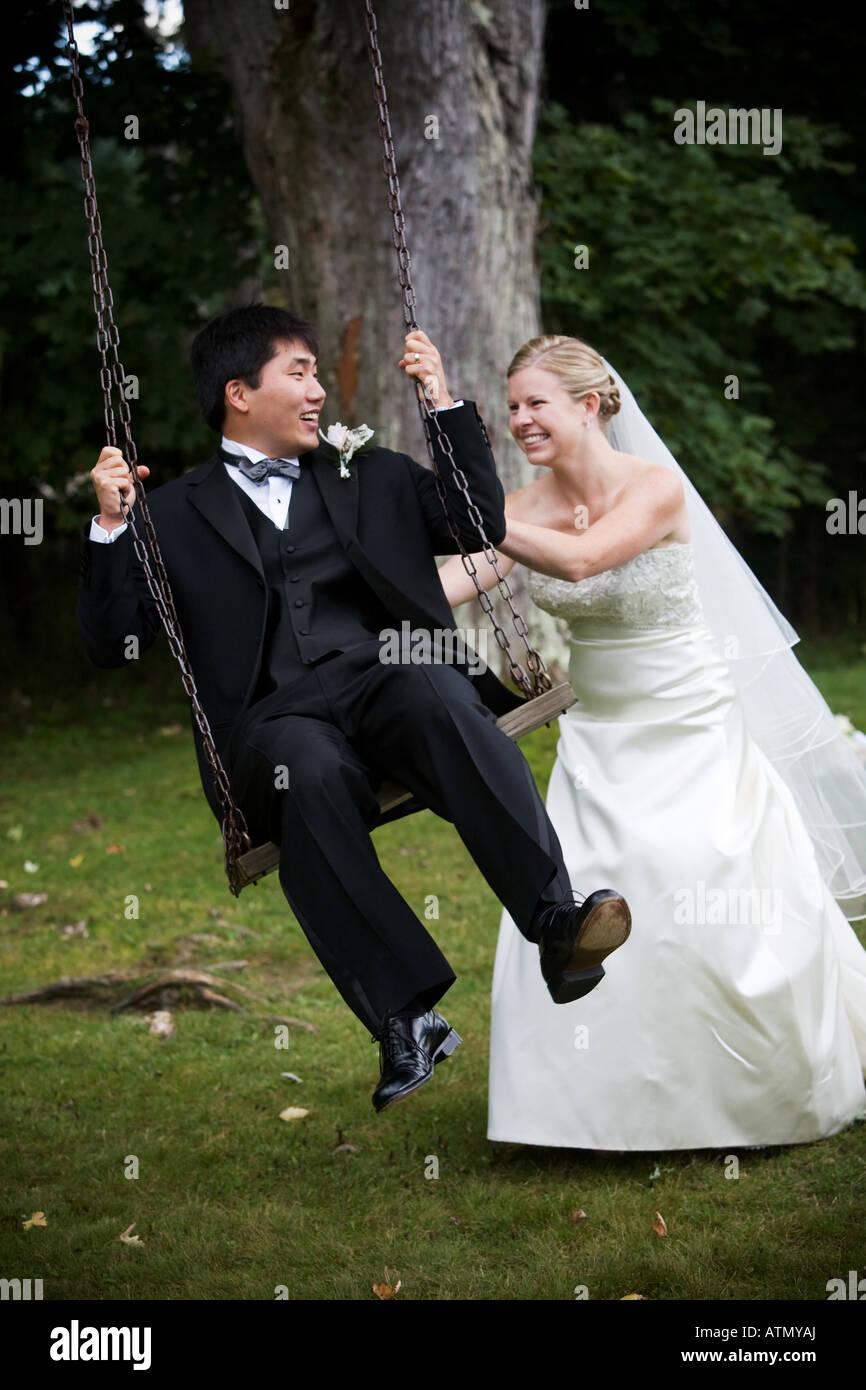 Woman being pushed on swing hi-res stock photography and images - Alamy